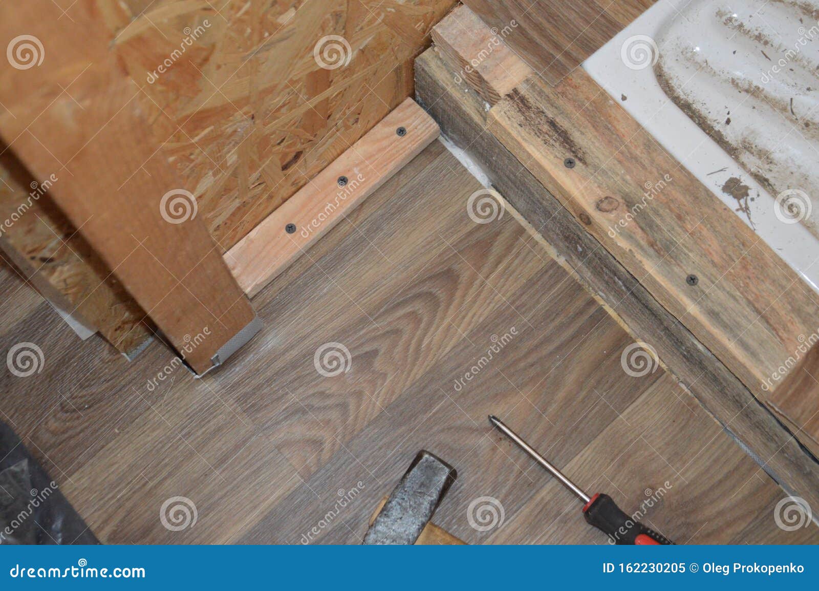 Installation of Thresholds and Baseboards in the Interior of a ...