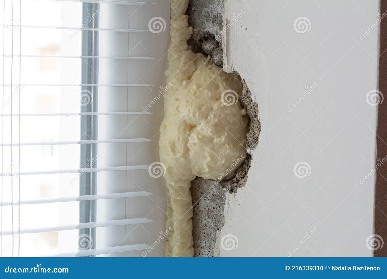 Installation of Windows. Polyurethane Foam on the Slope of the Window ...