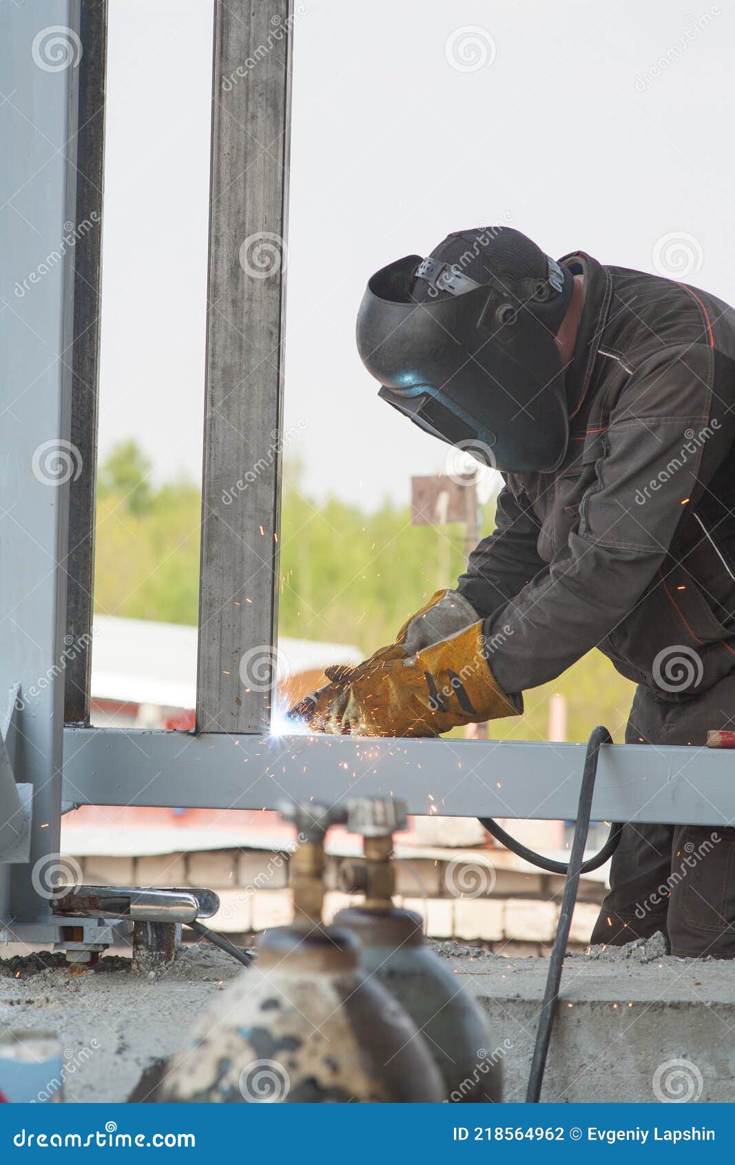 Installation Work of Electric Welding on a Clear Sunny Day at a ...