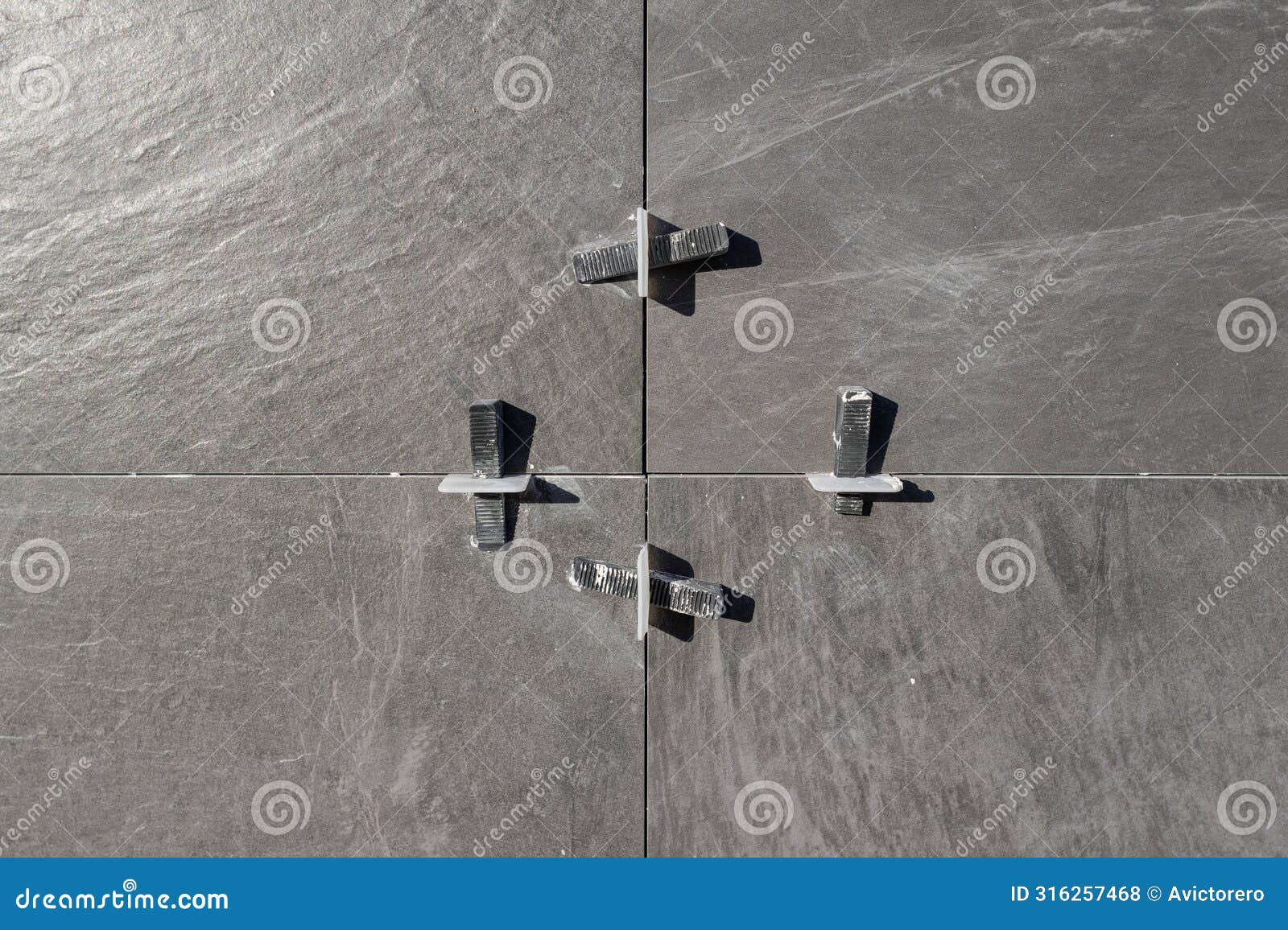 Installed Ceramic Tiles with Plastic Tile Leveling System Clips and ...