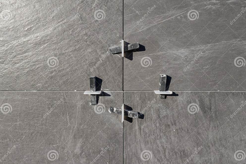 Installed Ceramic Tiles with Plastic Tile Leveling System Clips and ...