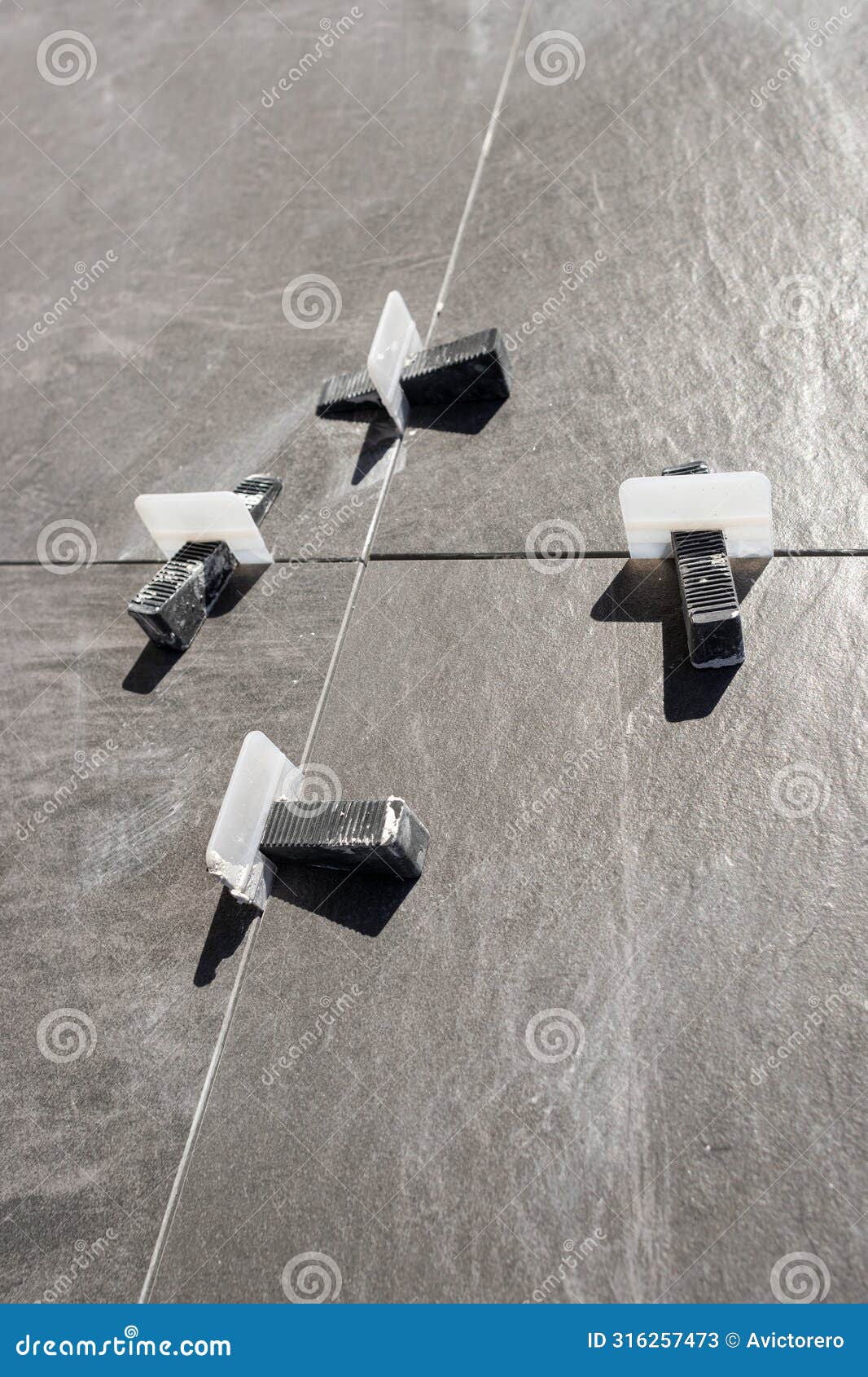 Installed Ceramic Tiles with Plastic Tile Leveling System Clips and ...