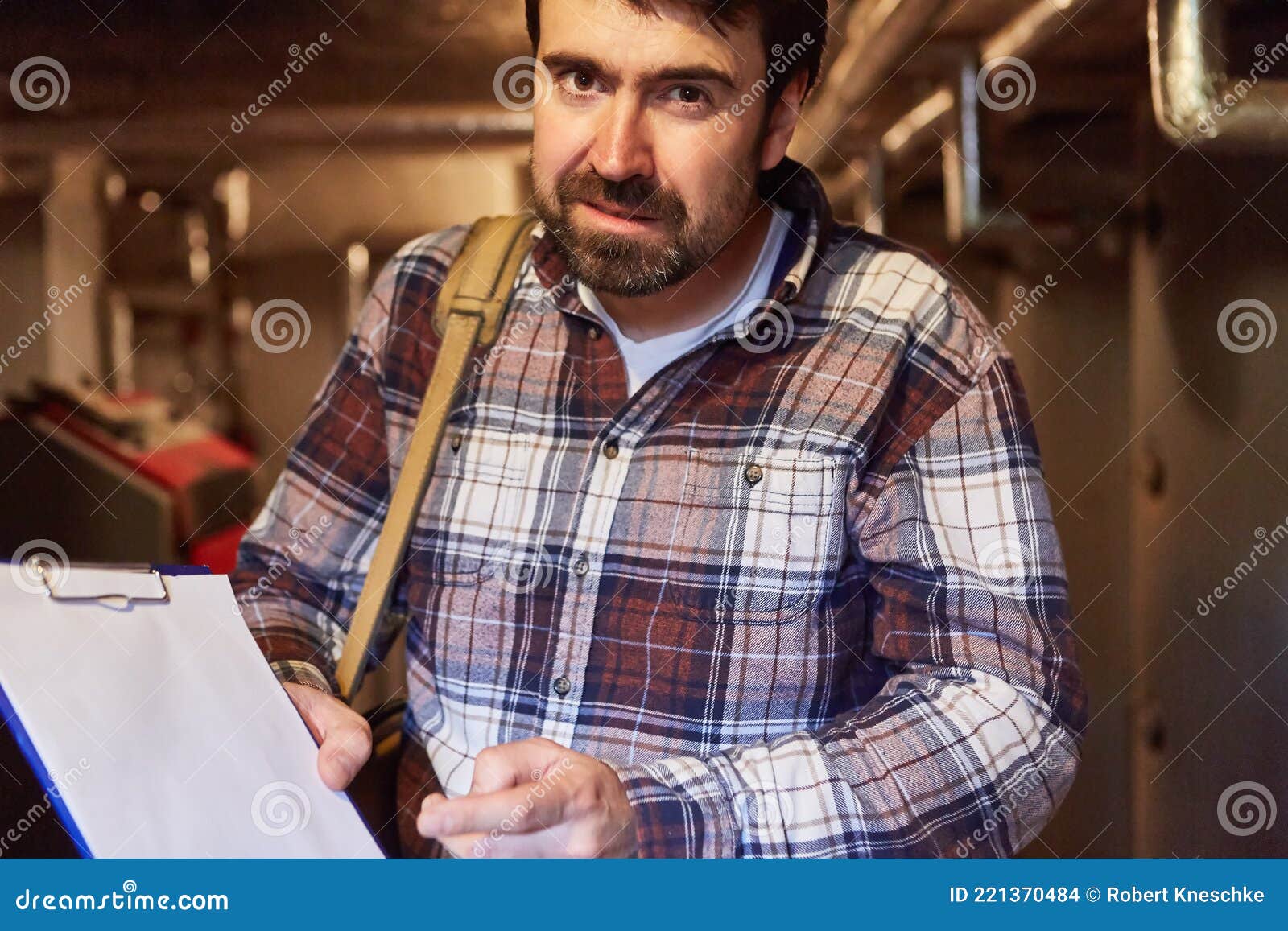 Installer Shows the Maintenance Contract for the Heating Stock Photo ...