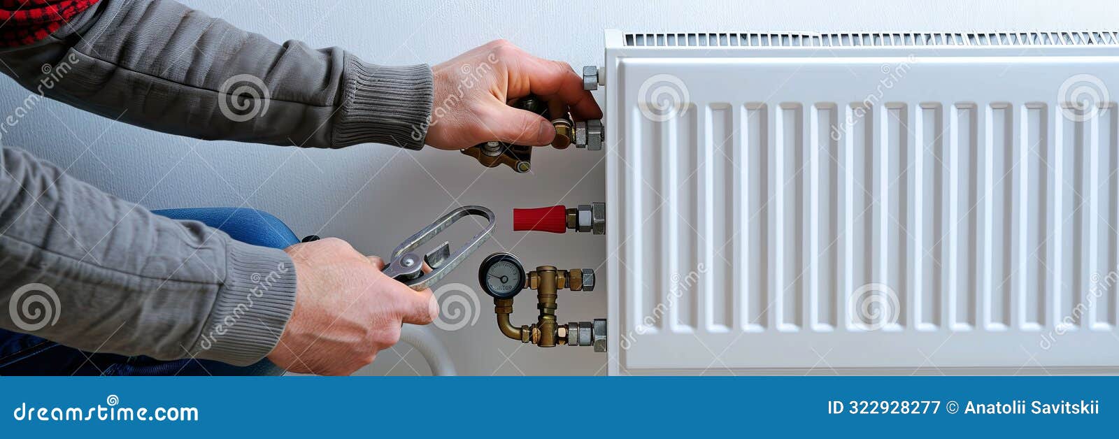 An Installer Working On The Installation Of A New Radiator In A ...