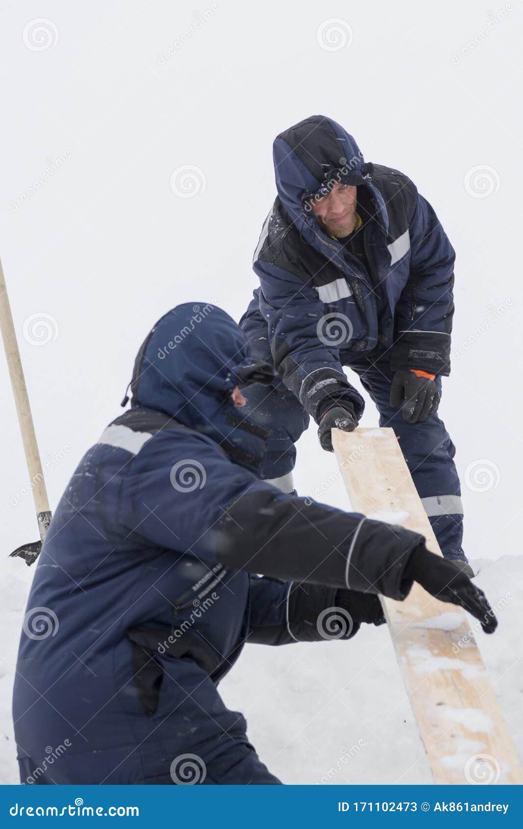 Two Workers in Overalls at a Construction Site Stock Image - Image of ...