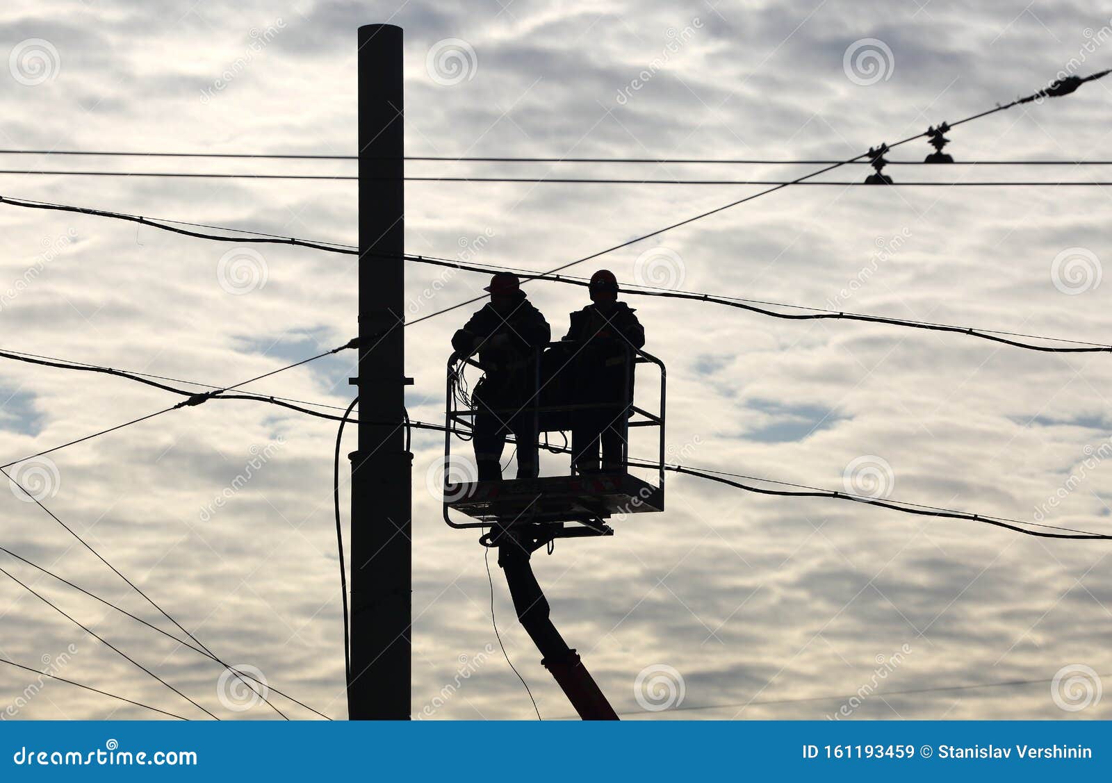 Installers Working on High-altitude Workers with Cables at Height on a ...