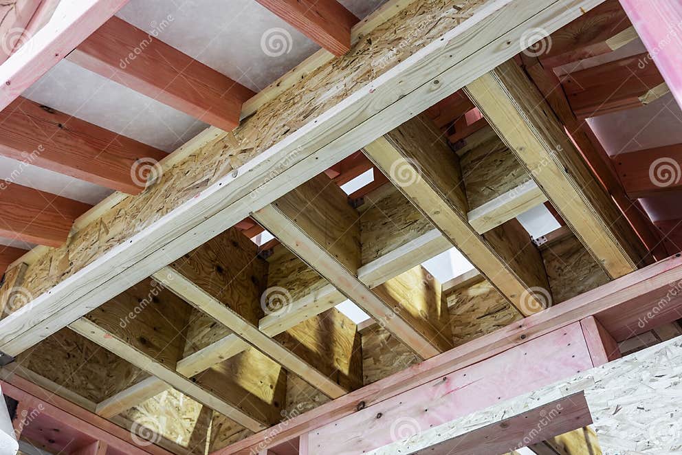 Installing Attic Insulation Material and Roof Support Truss System ...