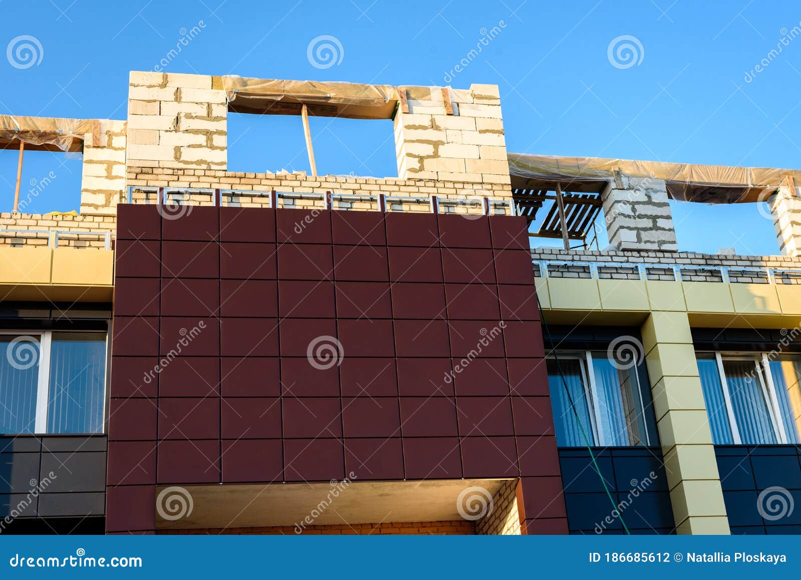 Installing Big Tile on a Building Facade Stock Photo - Image of ...