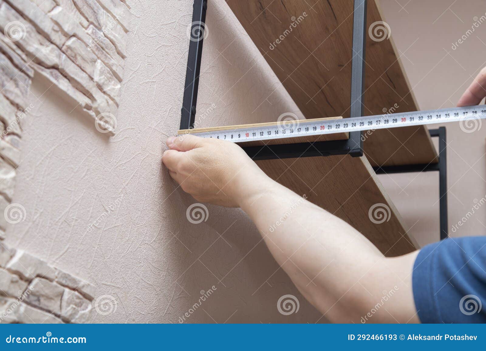 Installing Bookshelves on a Drywall Wall. Self-installation Stock Image ...