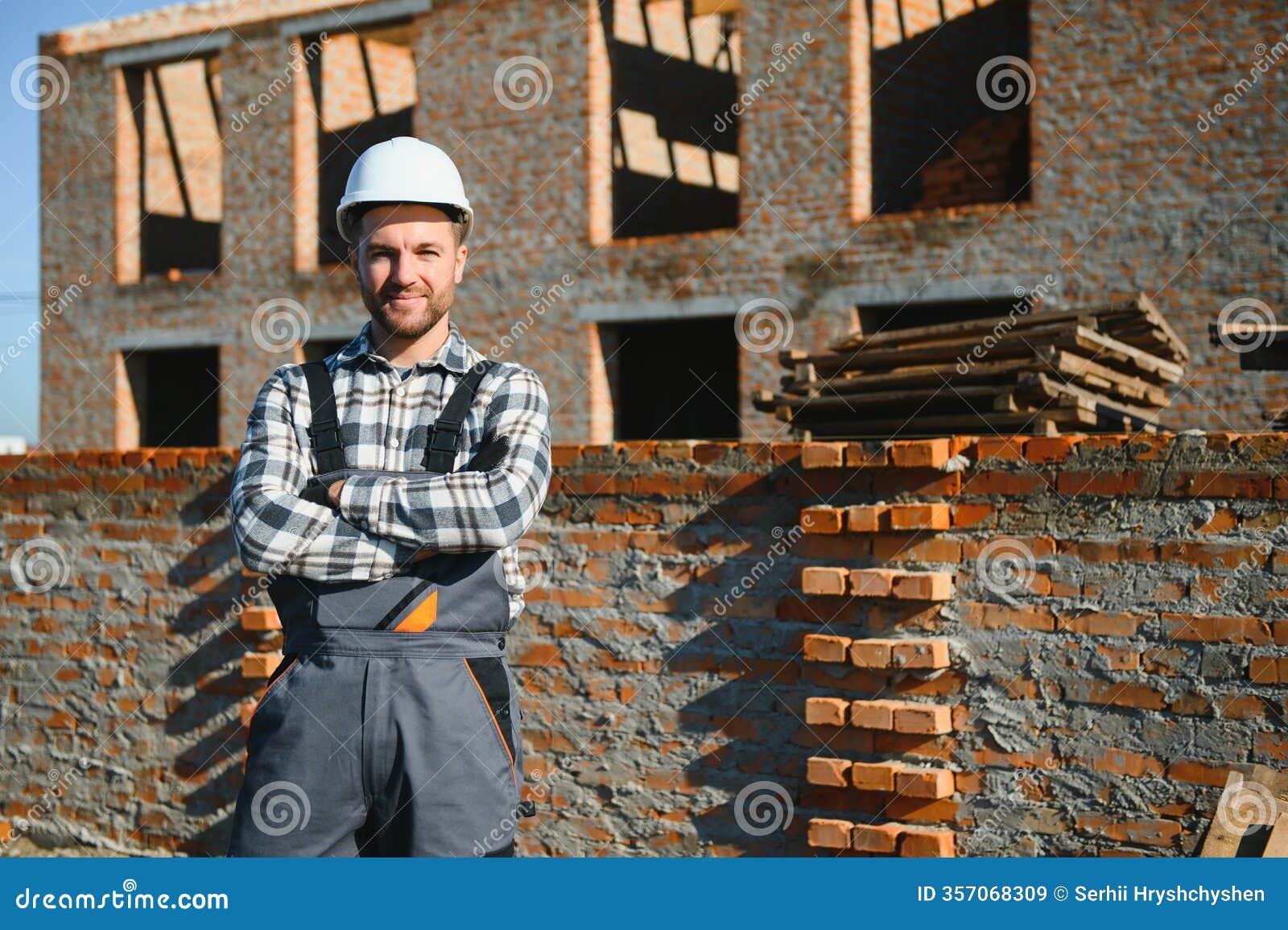 Installing Brick Wall. Construction Worker in Uniform and Safety ...