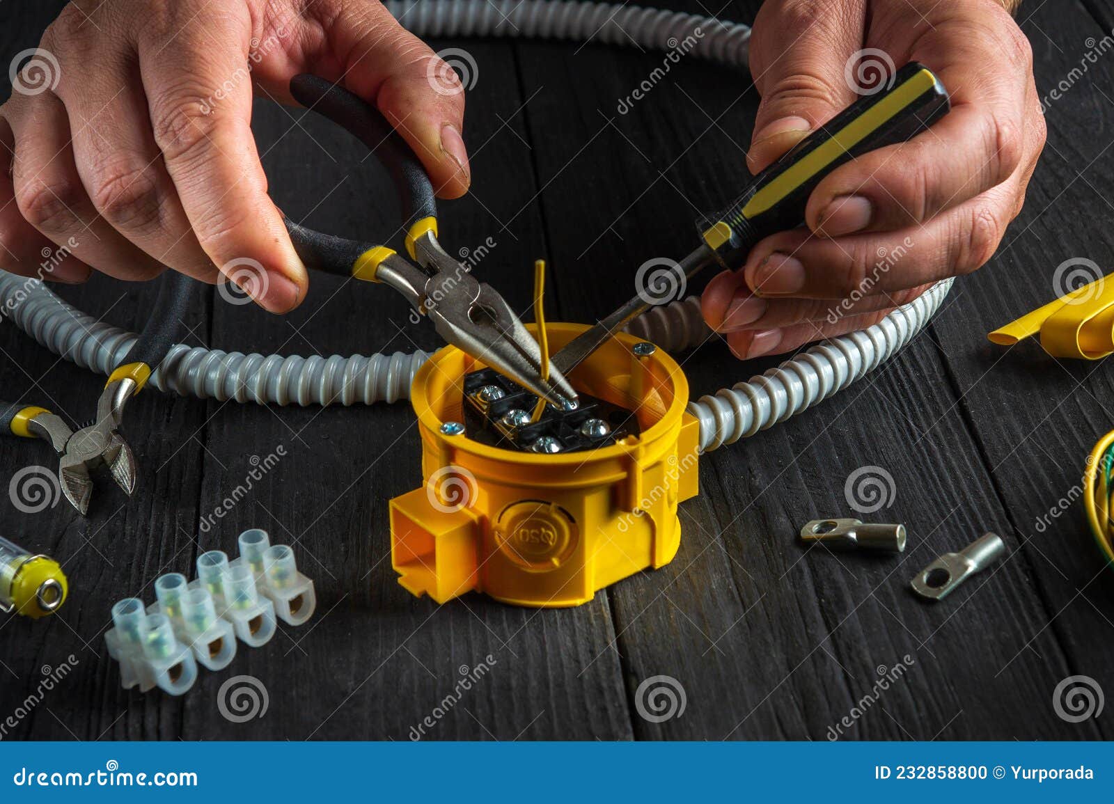 Installing a Cable or Wire To a Junction Box. Electrical Connection in ...