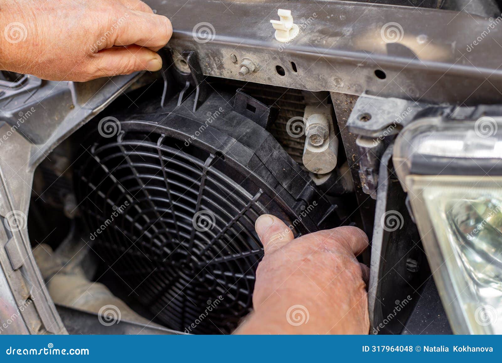 Installing a Car Engine Cooling Fan Under the Radiator Grille. Car ...