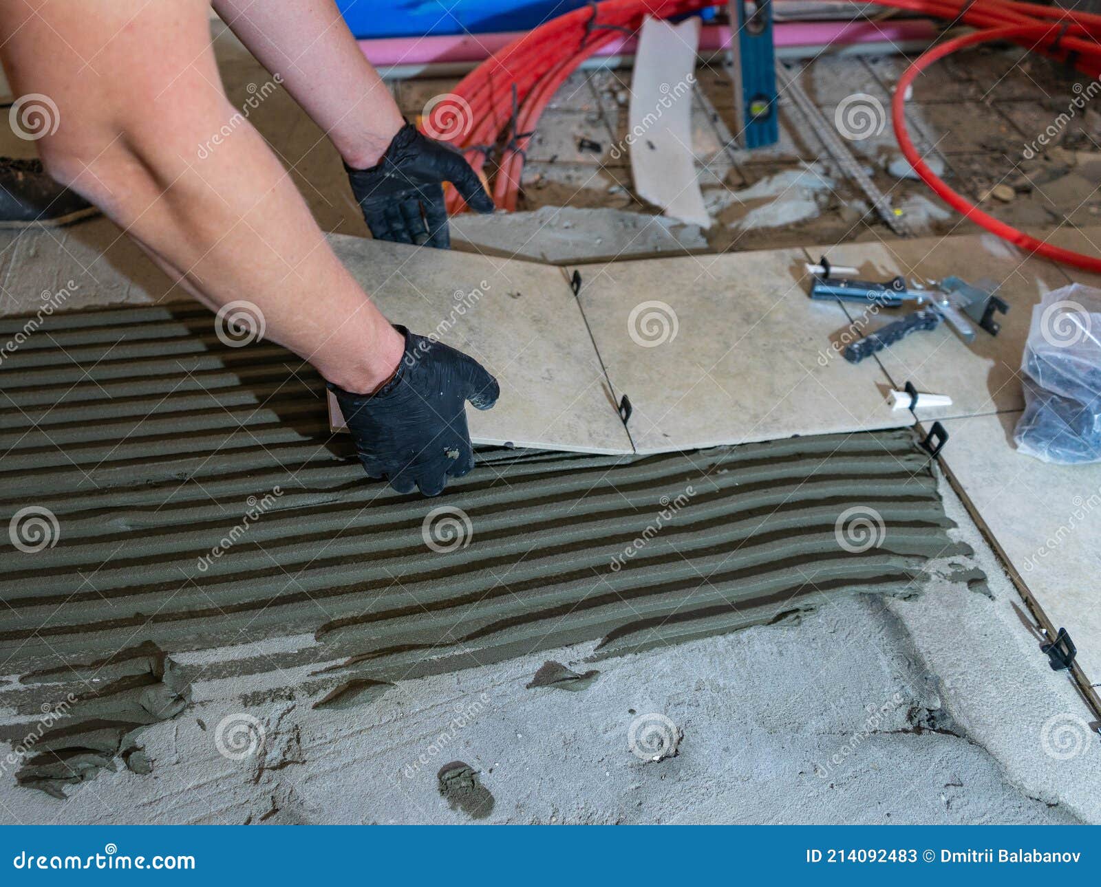 Installing Ceramic Floor Tiles - Placing the Tile into the Adhesive ...