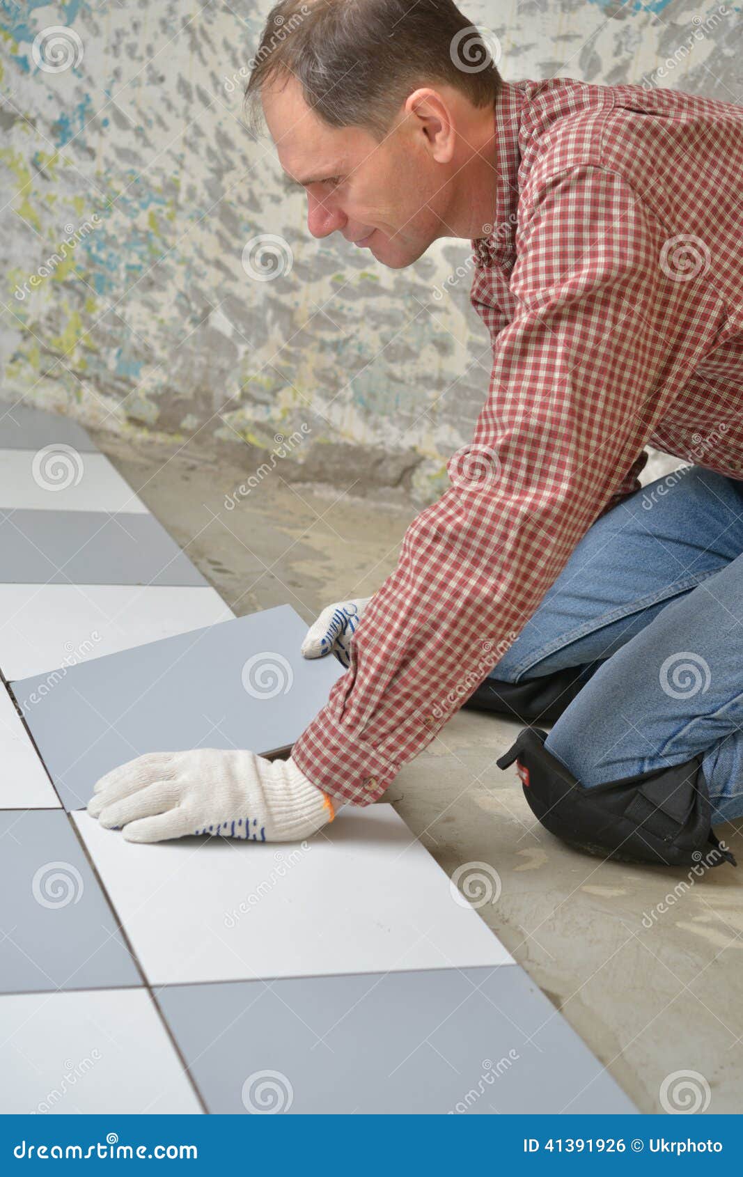 Installing Ceramic Tiles on a Floor Stock Photo - Image of pads, gray ...