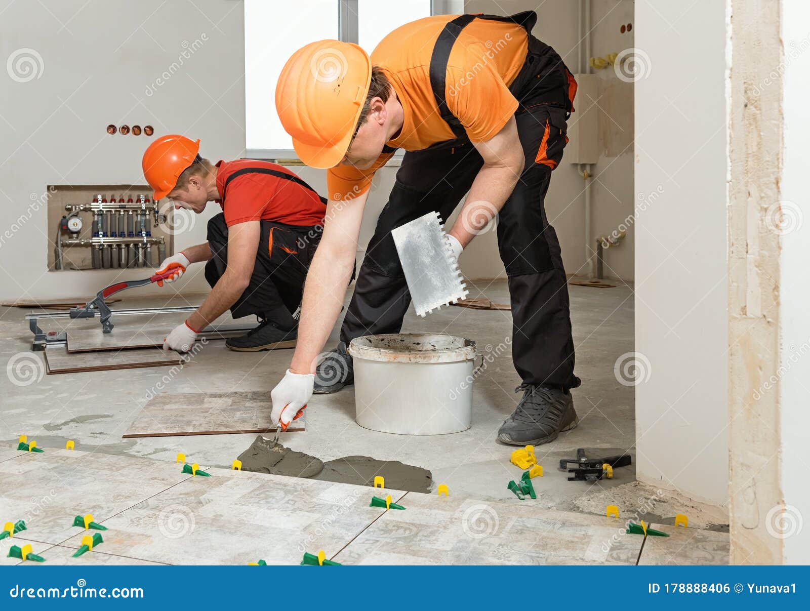 Installing Ceramic Tiles on the Floor Stock Photo - Image of handyman ...