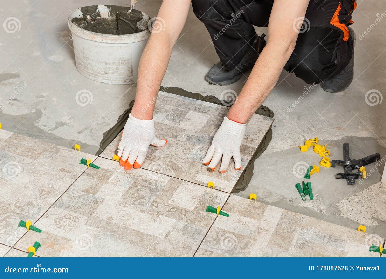 Installing Ceramic Tiles on the Floor Stock Photo - Image of modern ...