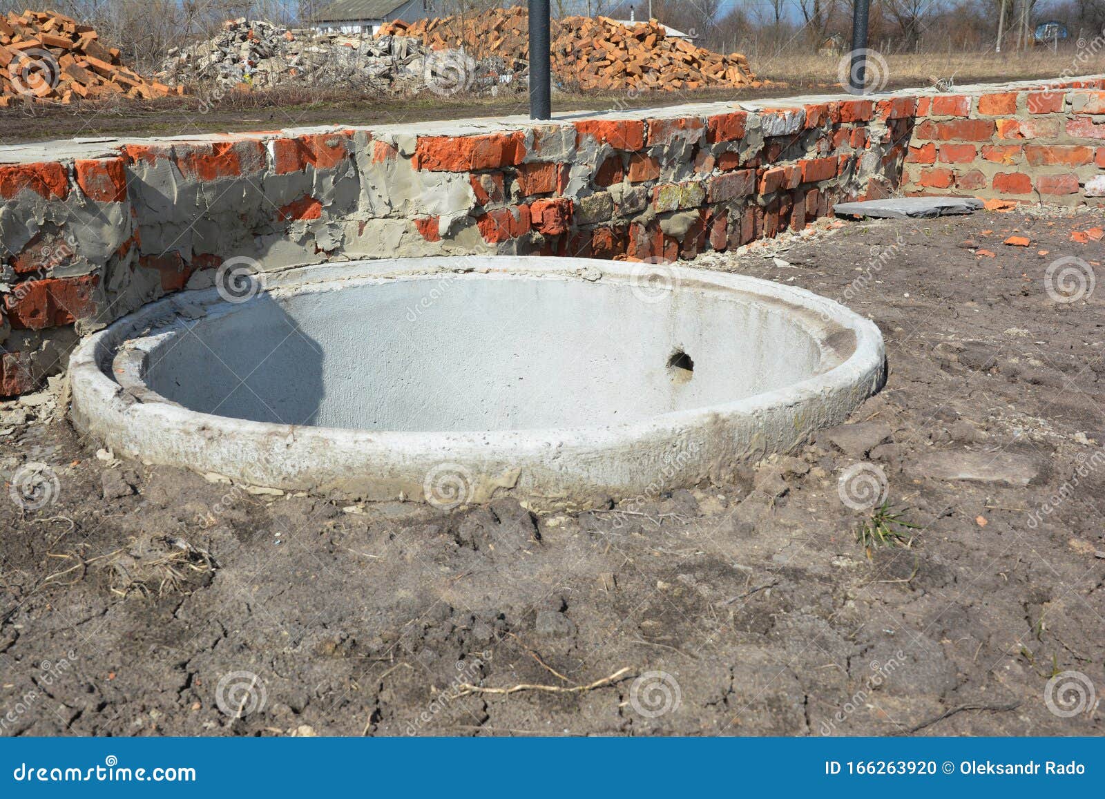 Installing Concrete Septic Tank. Sewer Tank Hole Installation Outdoors ...