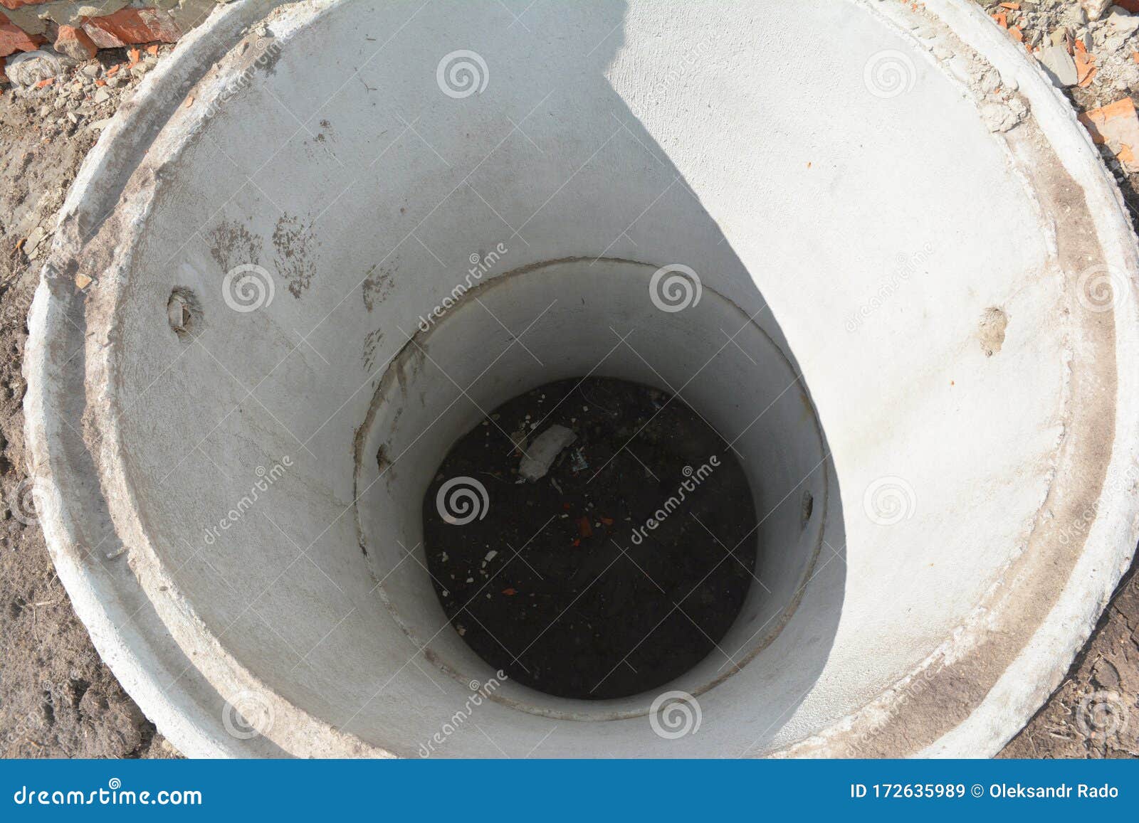 Installing Concrete Septic Tank. Sewer Tank Hole Installation Outdoors ...