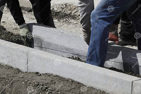 Installing Curbstone on Street Stock Photo - Image of cement, street ...