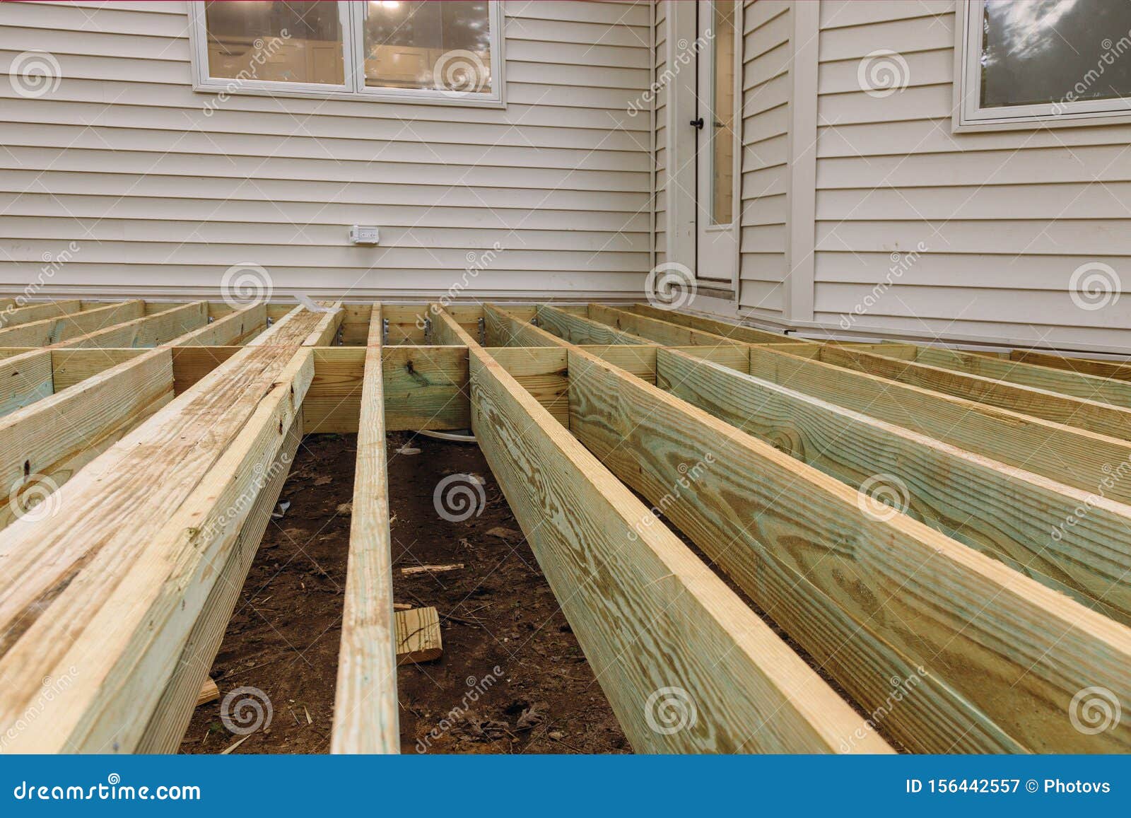 Installing Deck Boards with Above Ground Deck, Patio Construction Stock ...