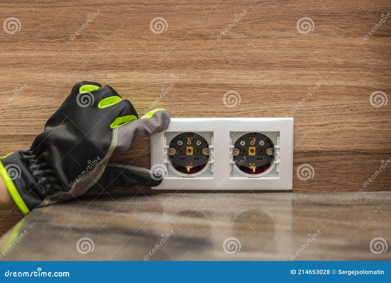 Installing Electrical Outlets. the Electrician Installs a Decorative ...