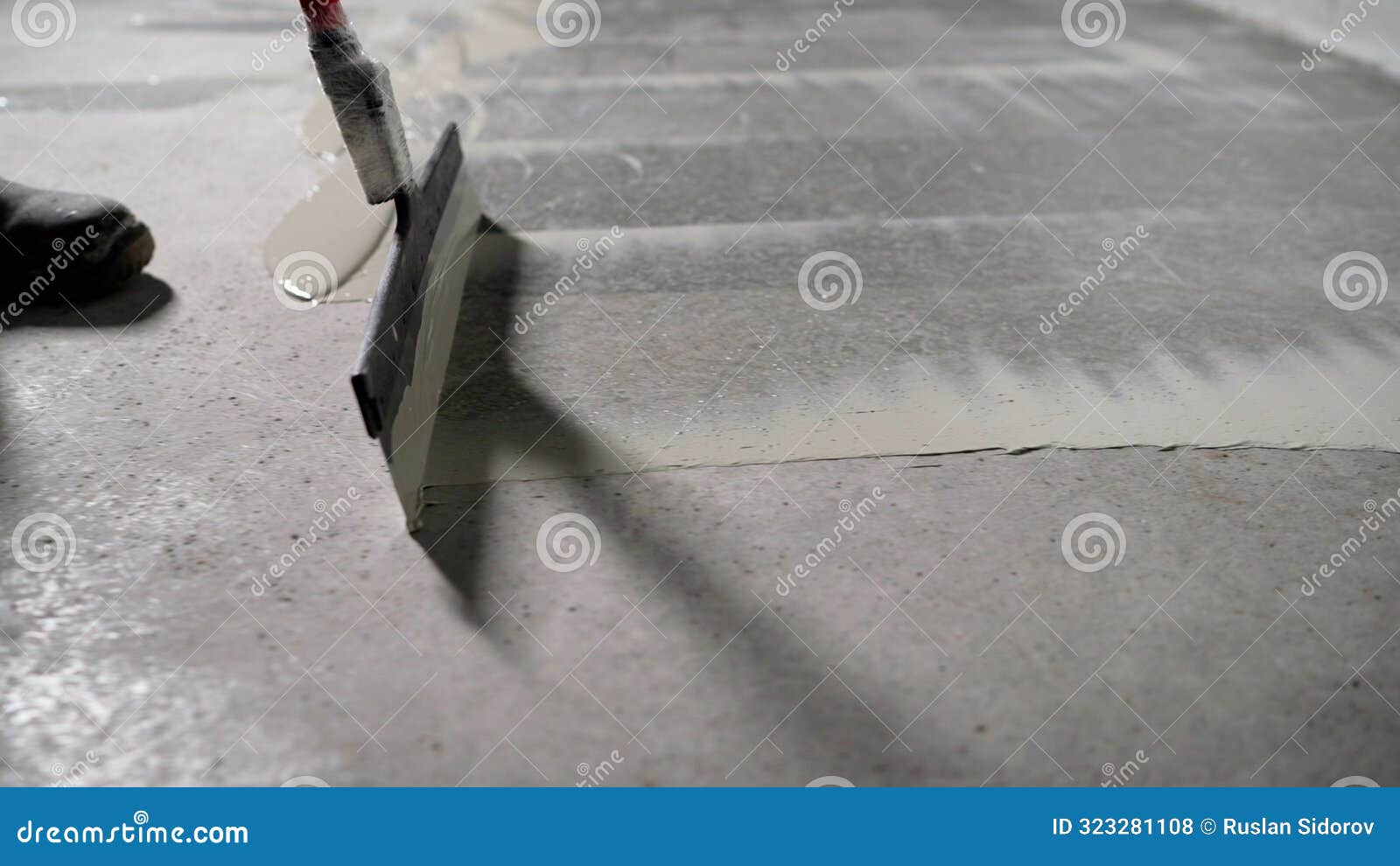 Installing an Epoxy Floor Over Existing Concrete. Smoothing the Primer ...