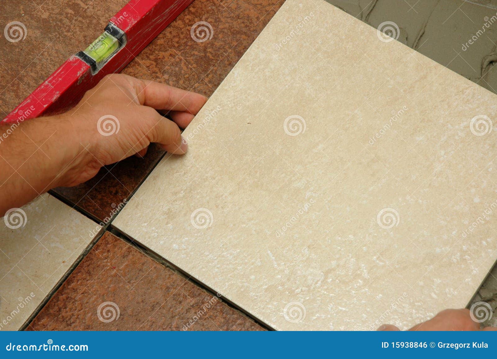 Installing Floor Tiles stock photo. Image of concrete - 15938846