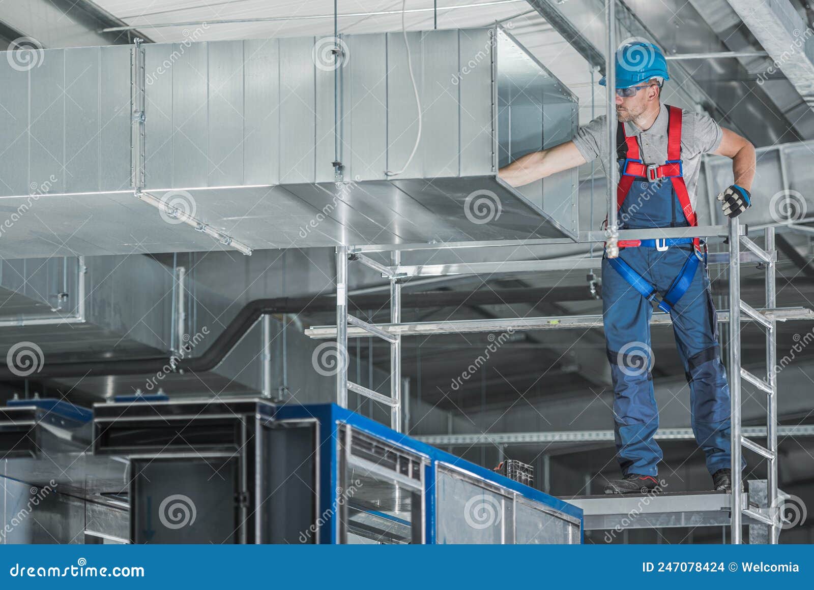 Installing HVAC System Air Circulation Duct Inside A Warehouse Stock ...