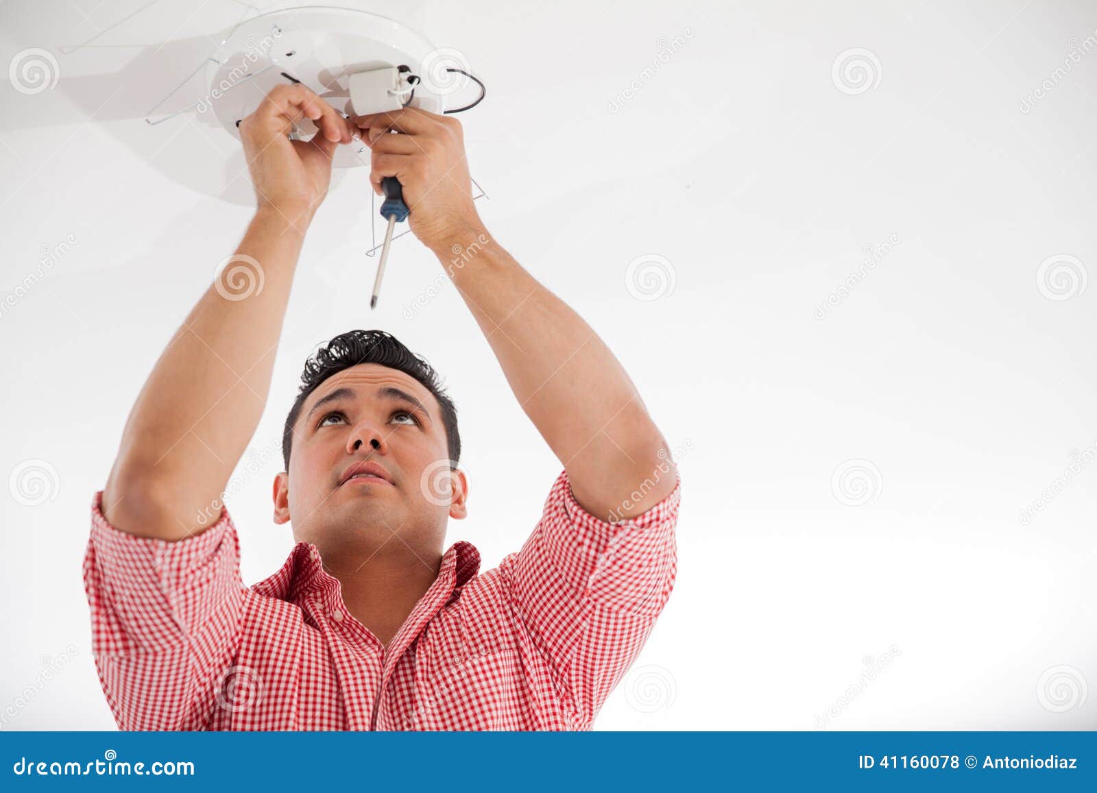 Installing a Lamp on the Ceiling Stock Photo - Image of attractive ...