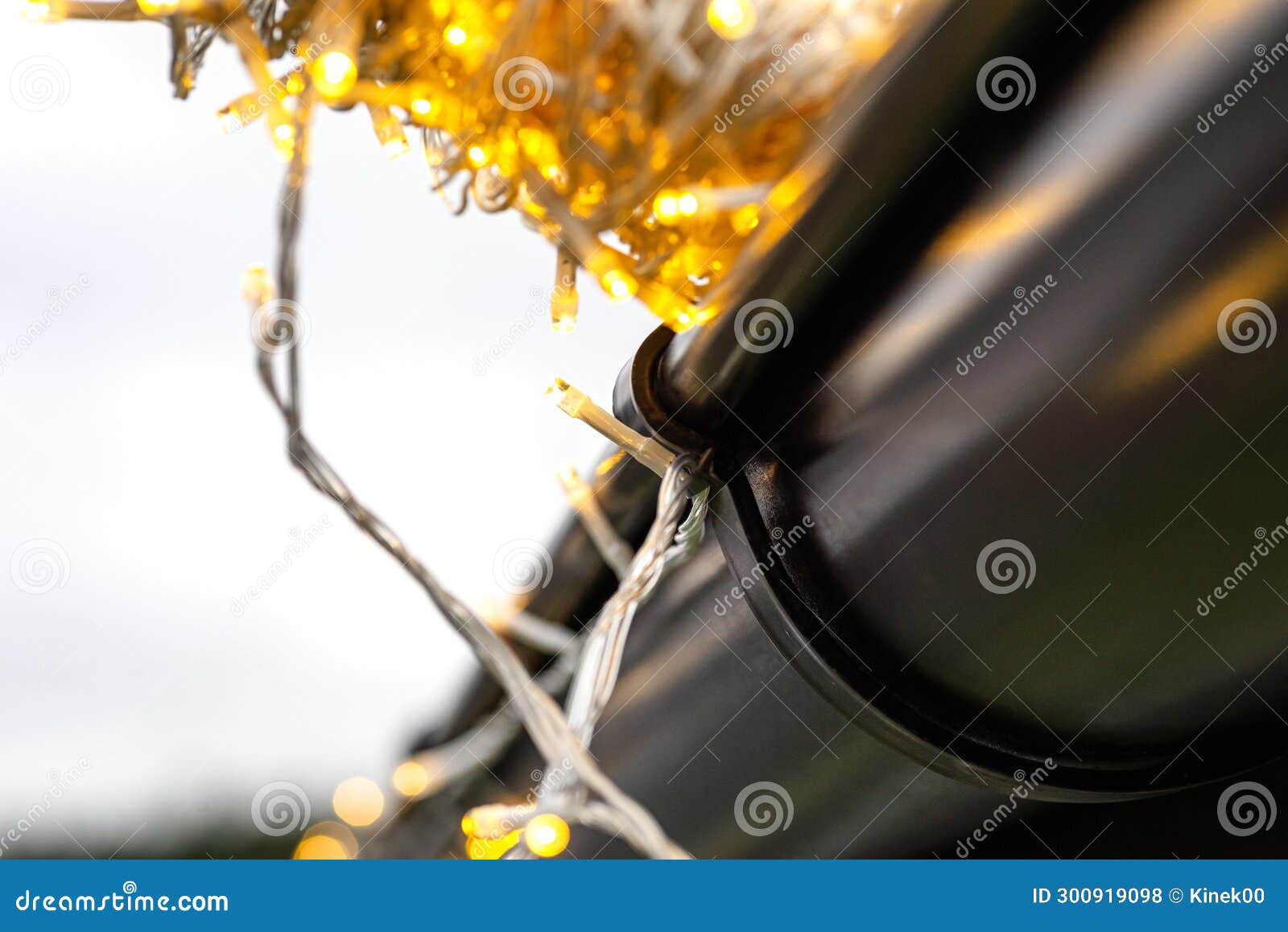 Installing LED Lights Along the Gutter Around the House, Decorating the ...