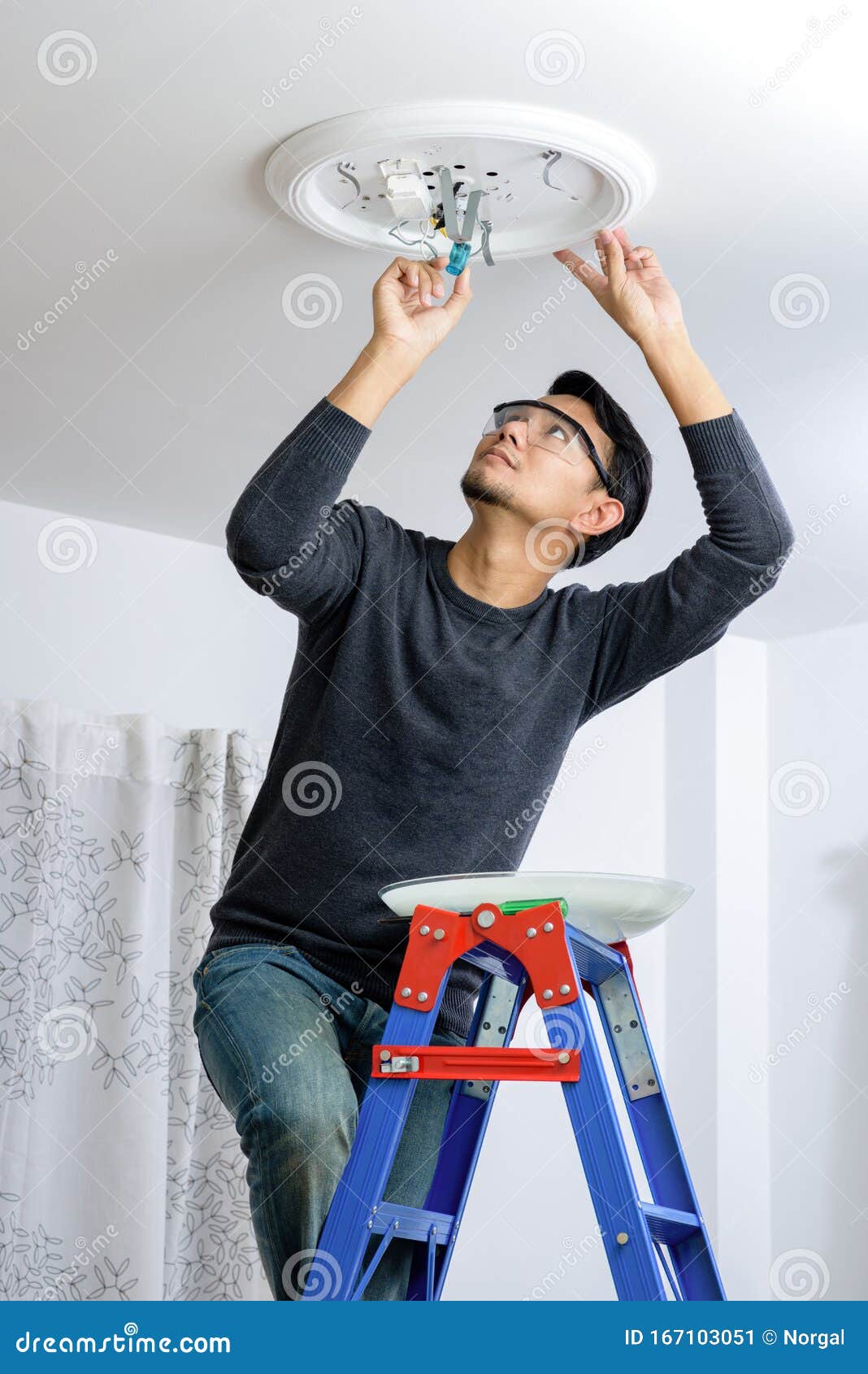 Installing light bulb stock image. Image of electricity - 167103051