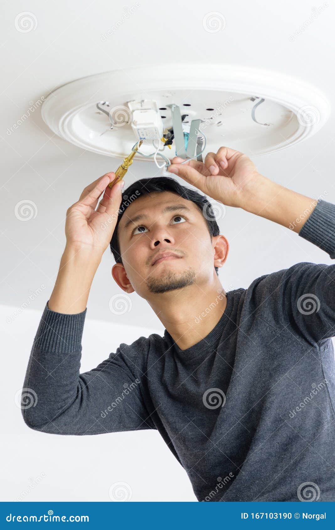 Installing light bulb stock photo. Image of asian, labor - 167103190