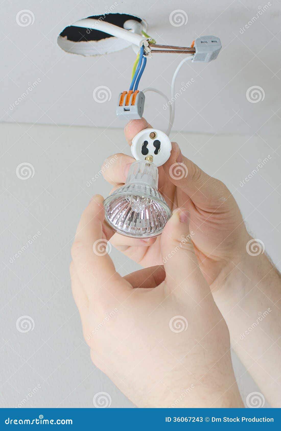 Installing of light bulb stock image. Image of assembling - 36067243