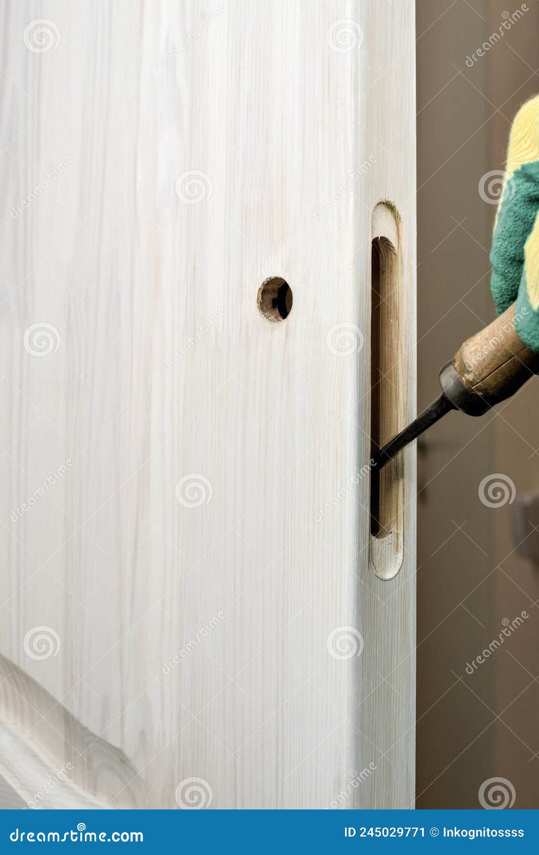 Cutting a Hole for a Door Lock with a Carpenter Chisel Stock Image ...