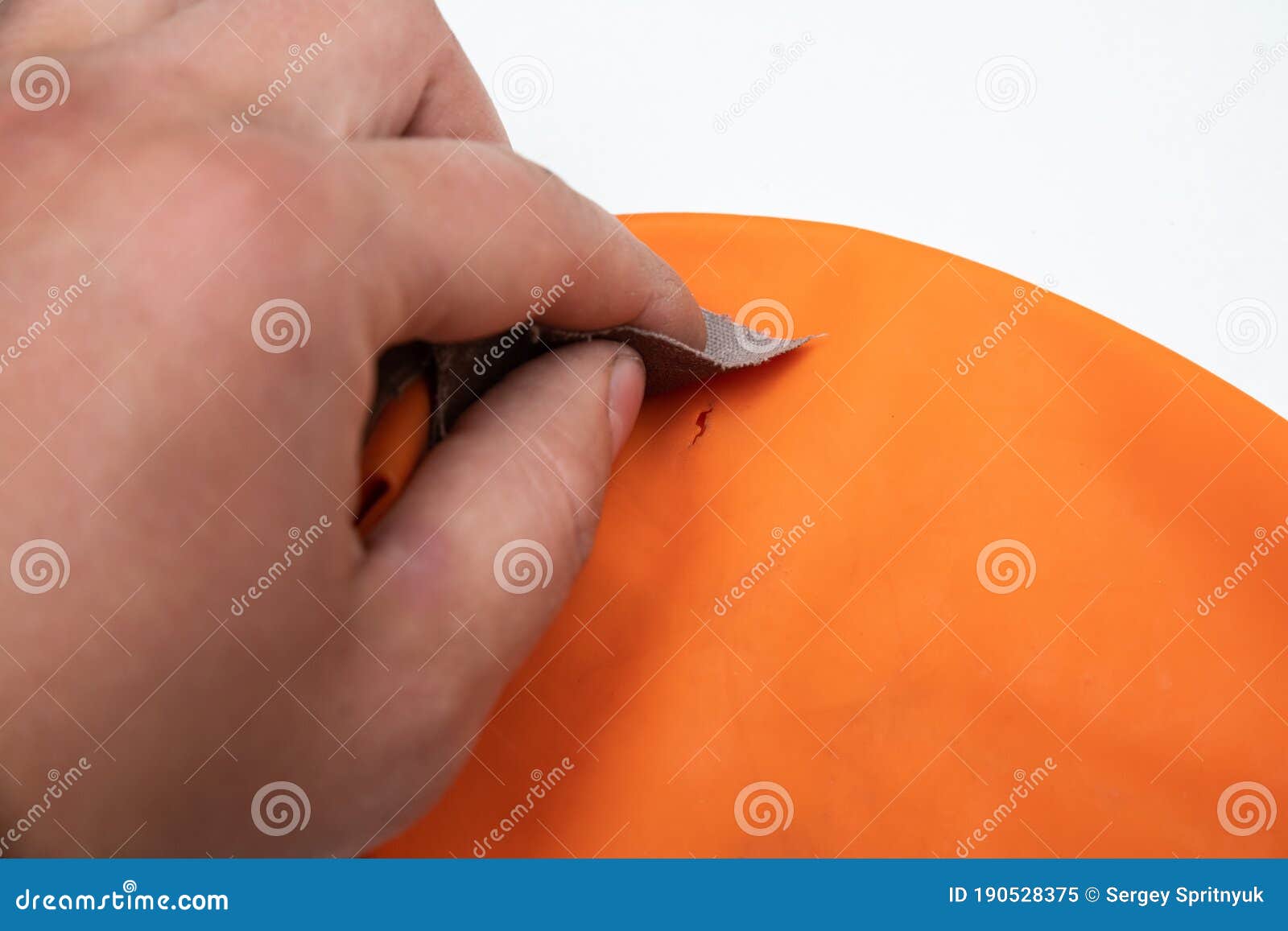 Installing the Patch on the Rubber Chamber. Scraping with Sandpaper ...