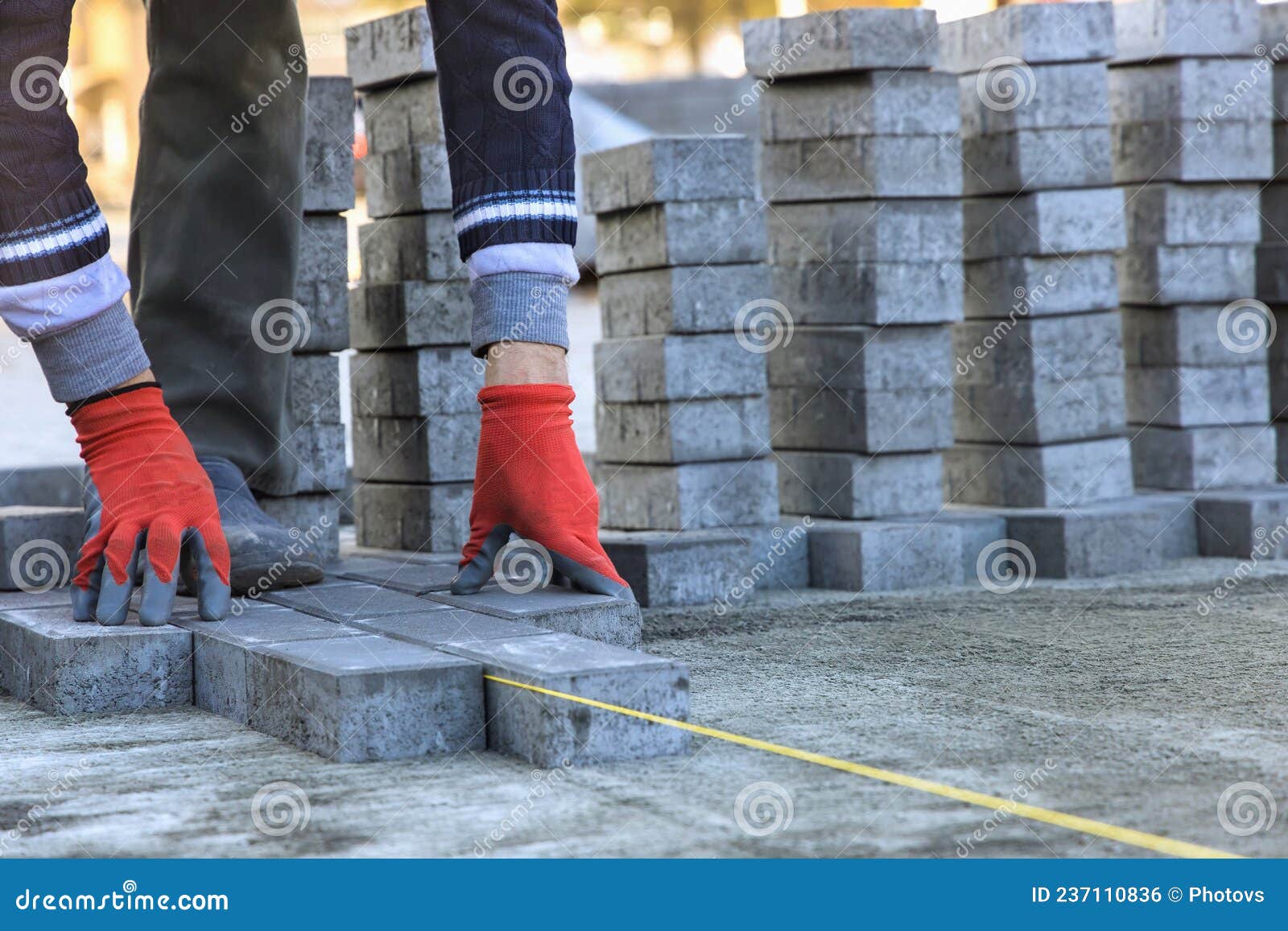Installing Paving Bricks On Patio At Construction Site. Laying Paver ...