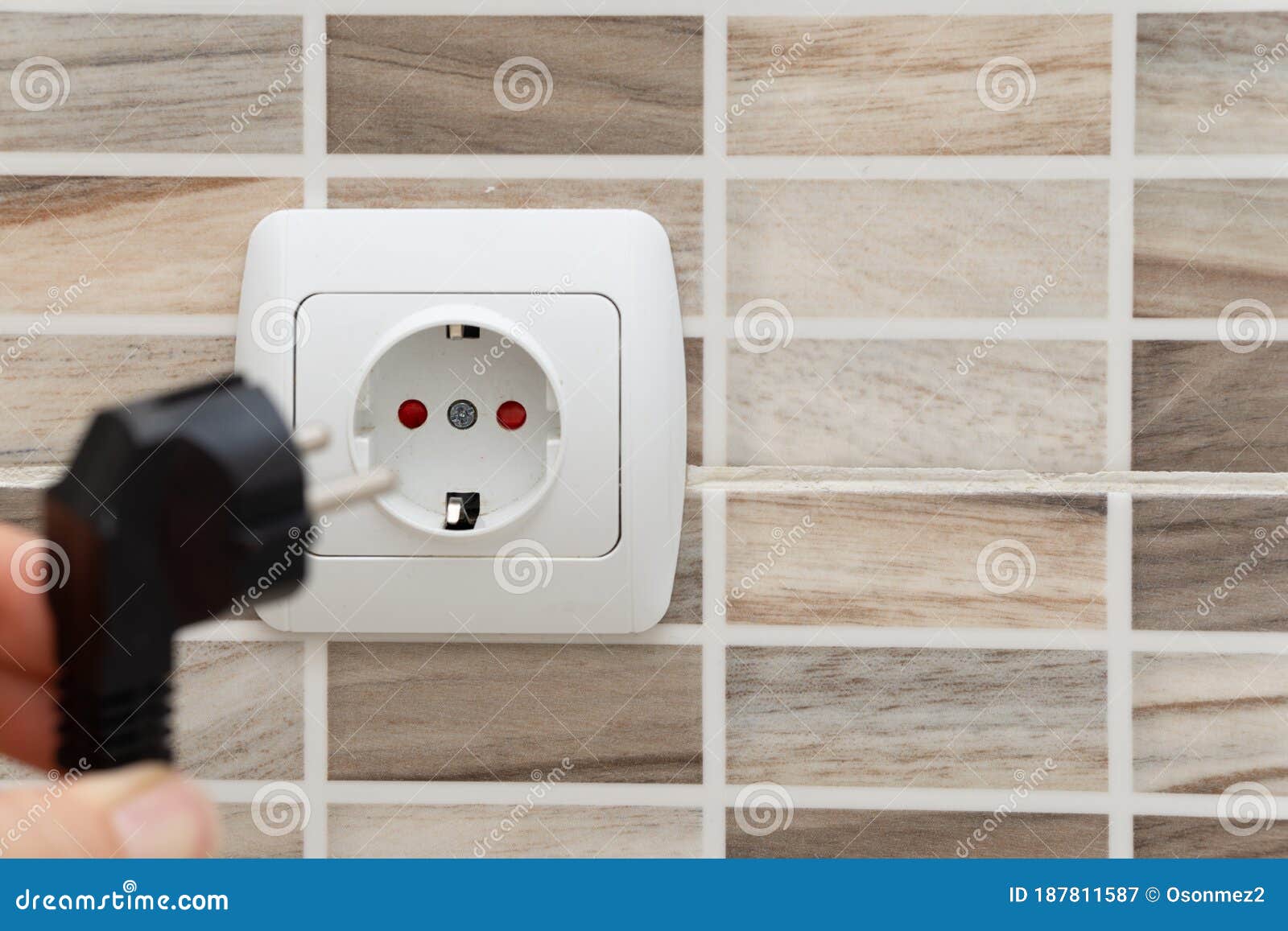 Installing Plug into the Electrical Outlet on the Wall Stock Image ...