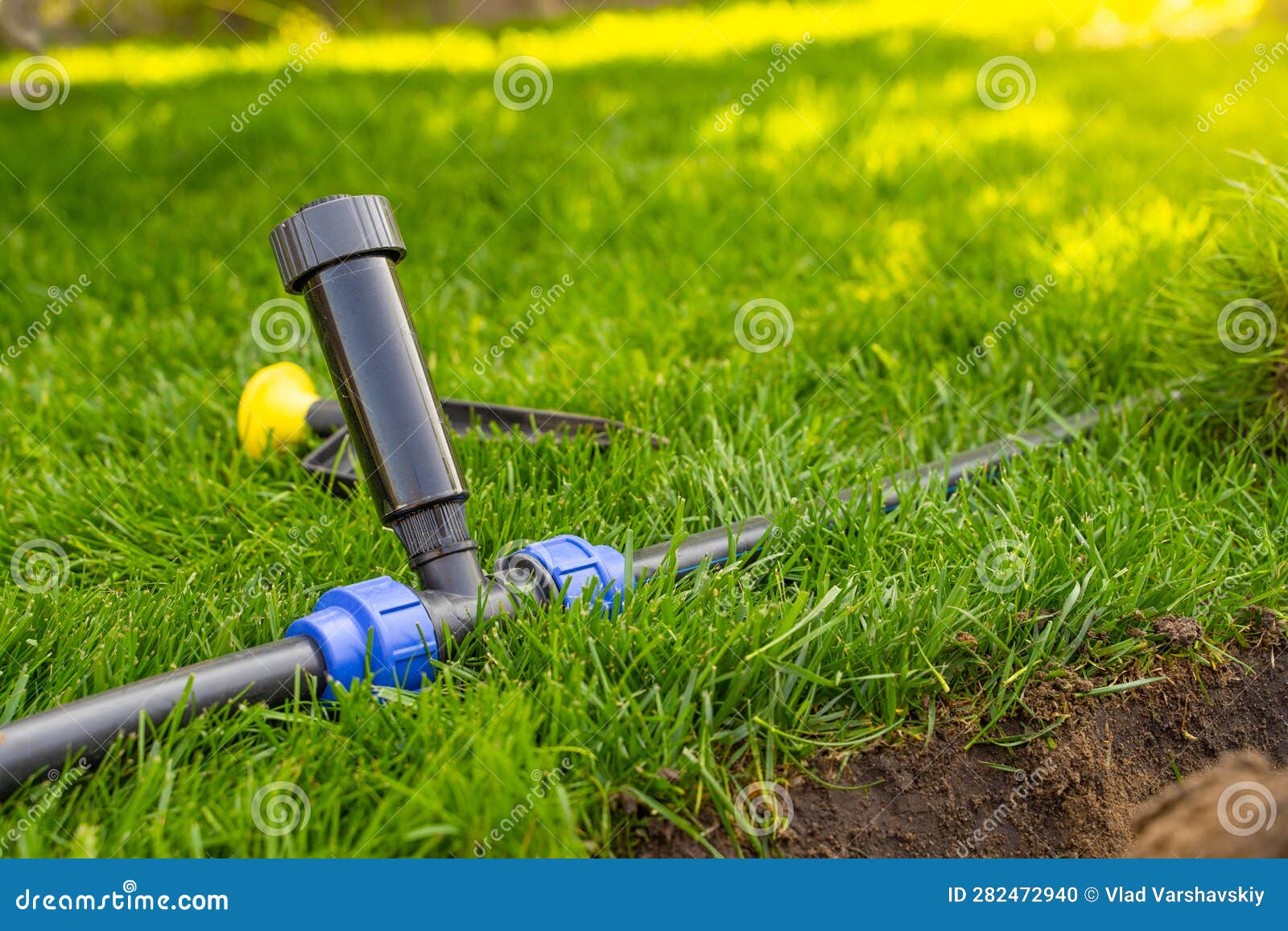 Installing a Pop-up Sprinkler in the Lawn, Close-up. Grass Irrigation ...