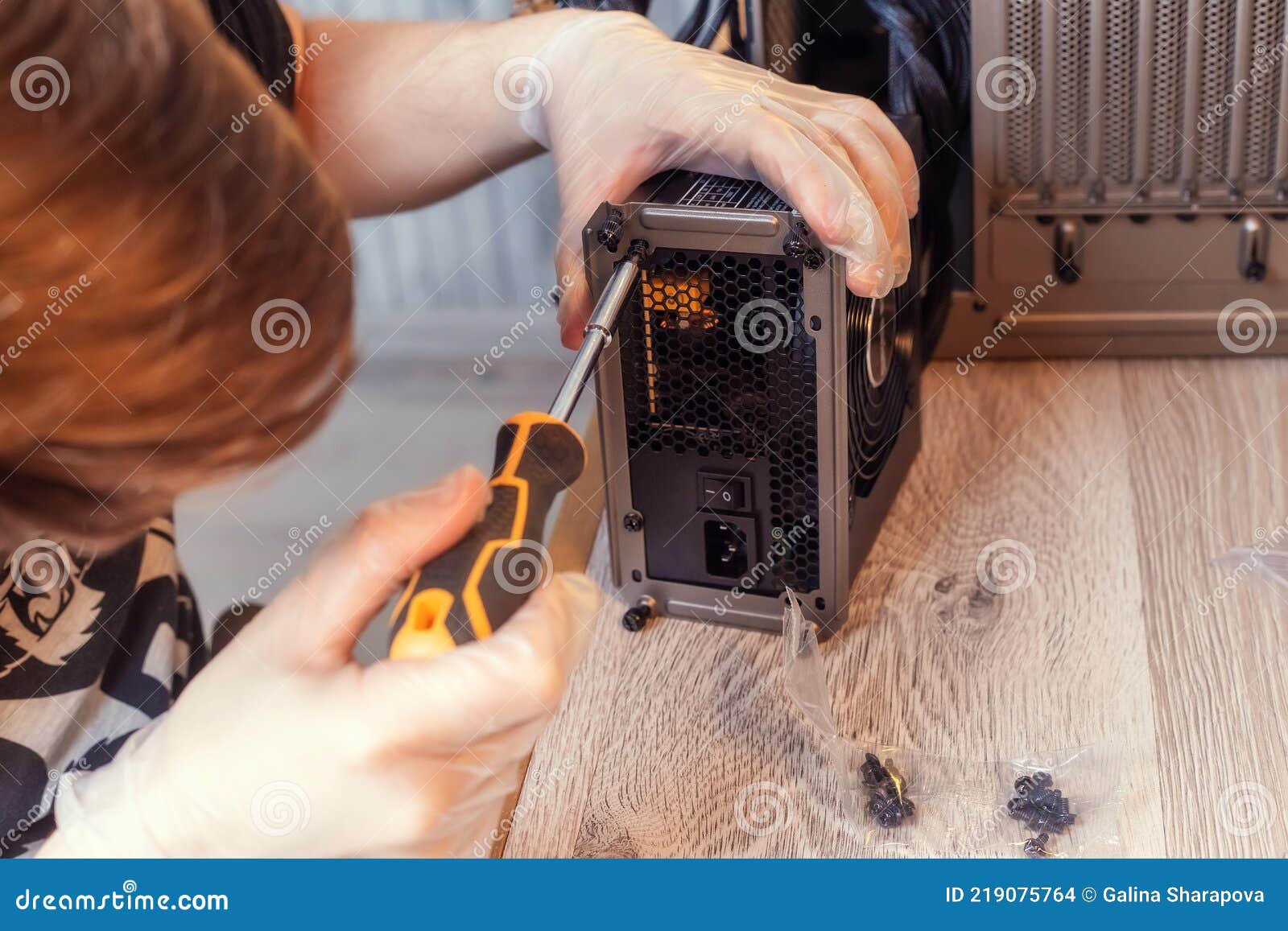 Technician is Installing a New Power Supply into a Computer. Stock ...