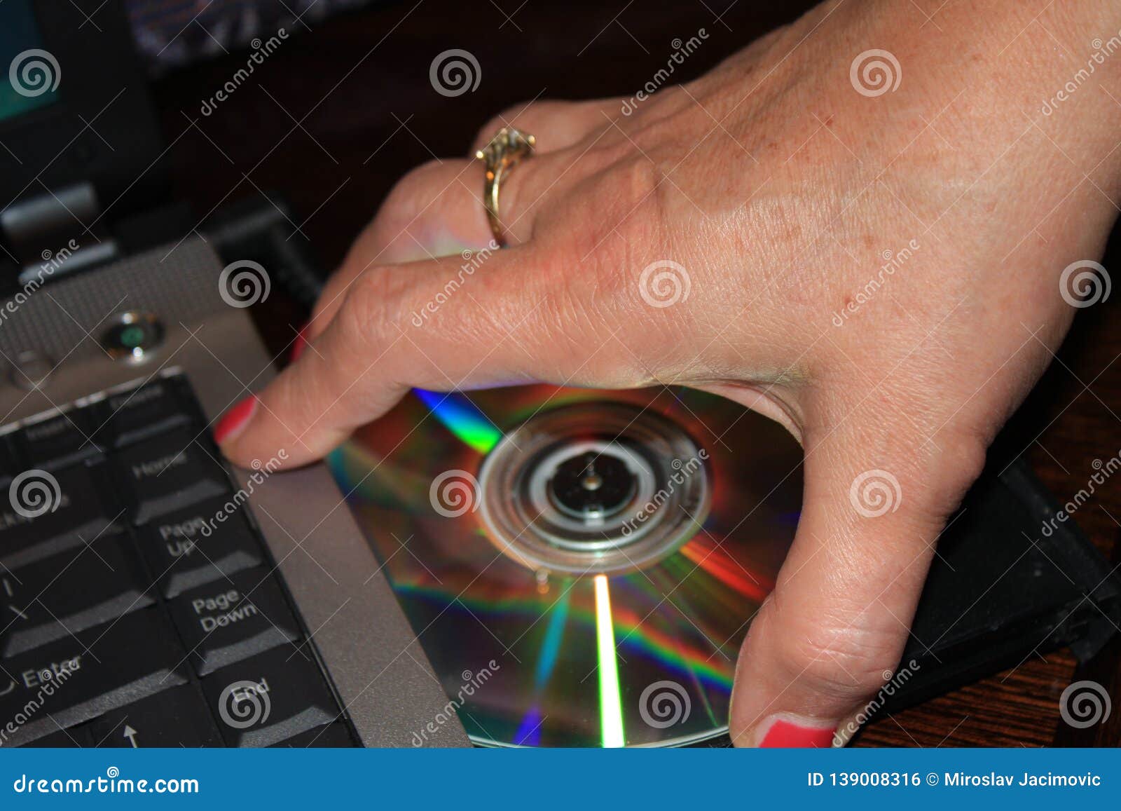 Installing Program from DVD To Laptop Computer - Image Stock Photo ...