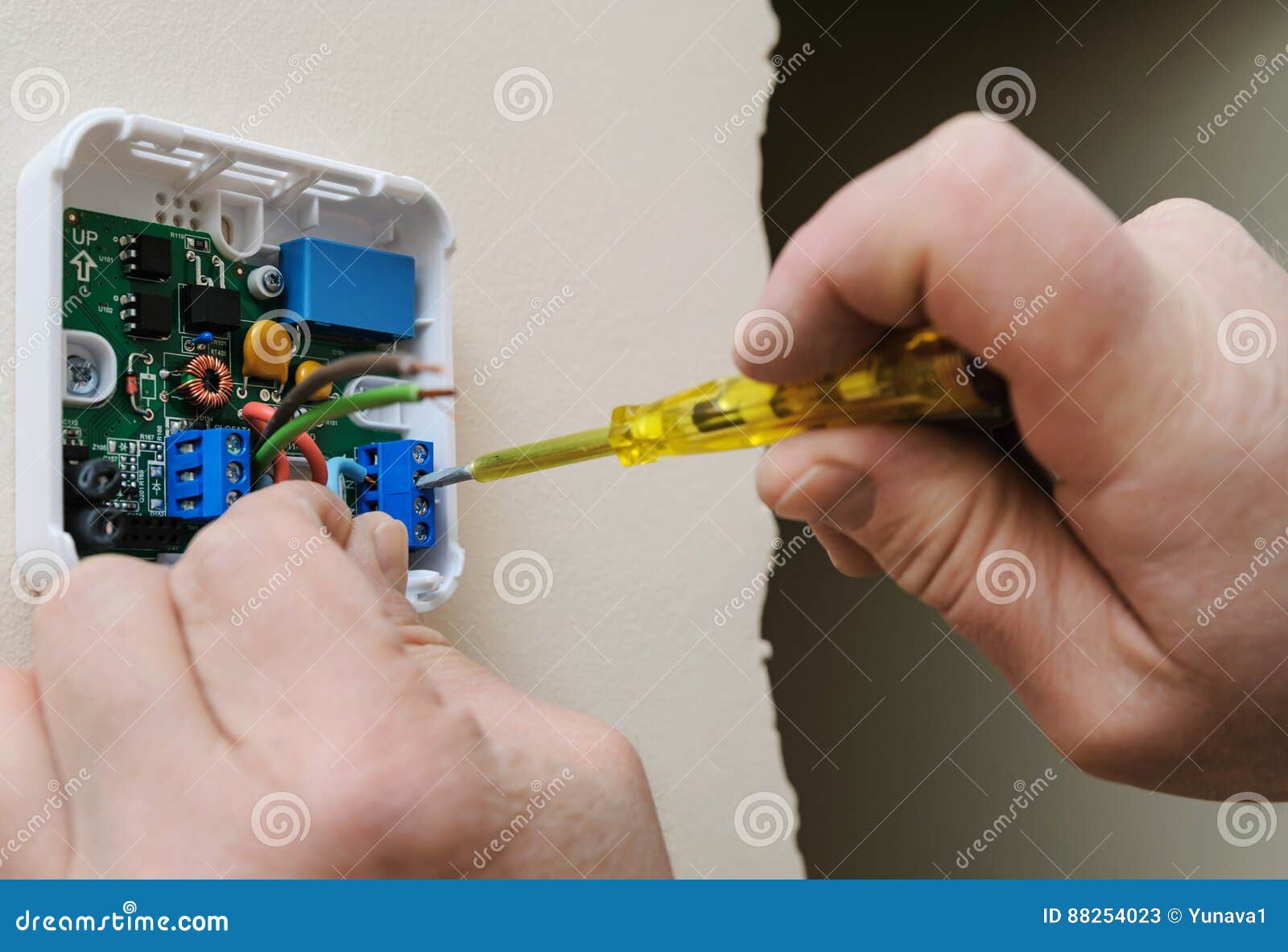 Installing A Programmable Room Thermostat. Stock Image | CartoonDealer ... Installing A Programmable Room Thermostat. Stock Image | CartoonDealer ...
