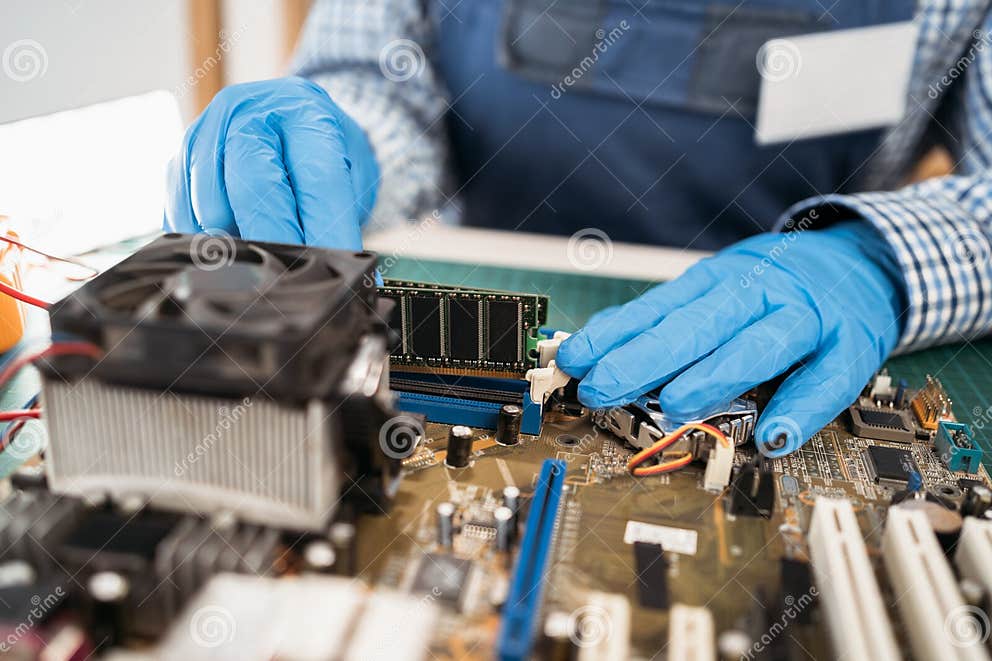Installing Random Access Memory into PC. Computer Service Engineer Technician Workplace ...