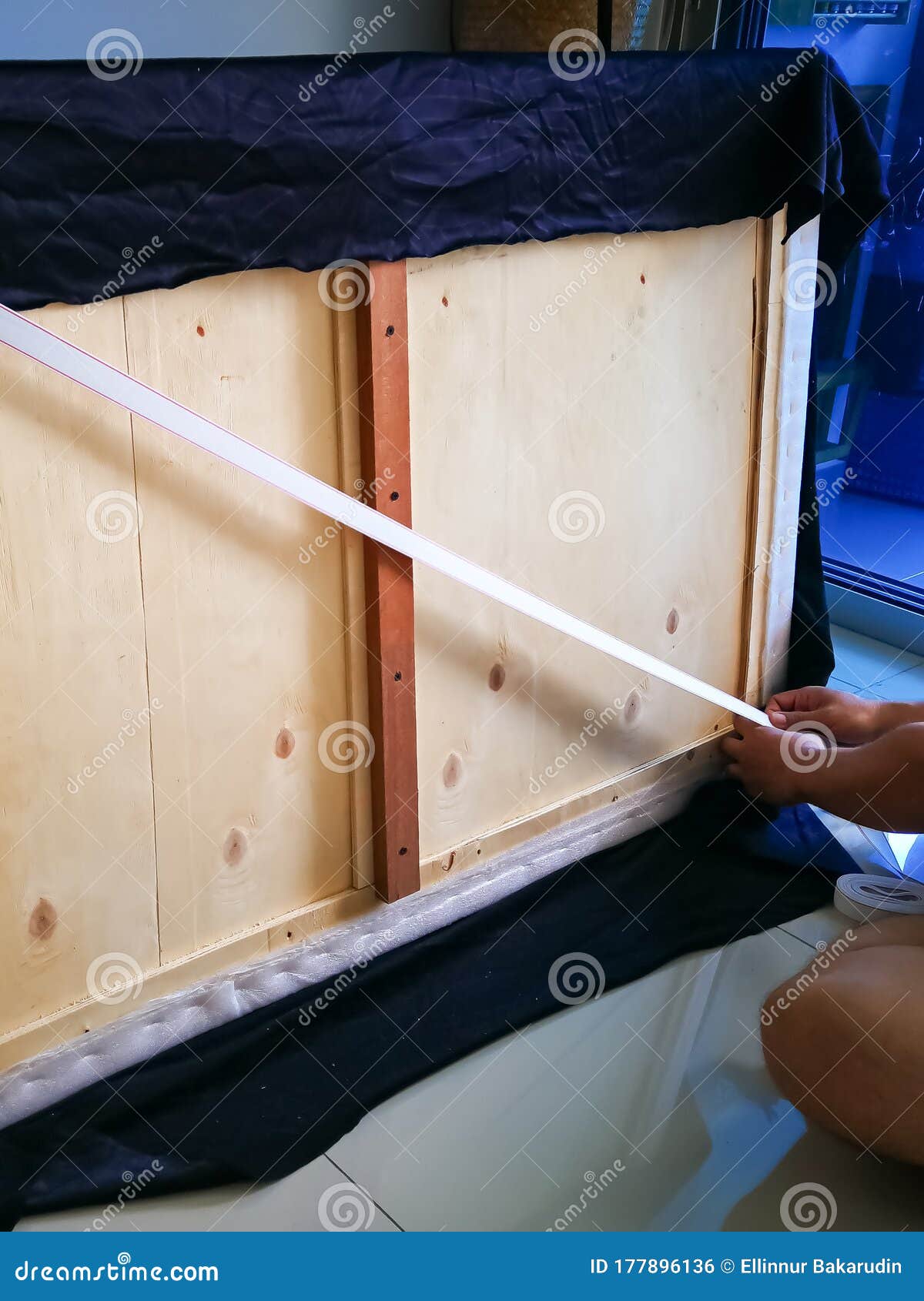 Installing a Rubber Elastic Band at the Other Side of the Wood Plank ...