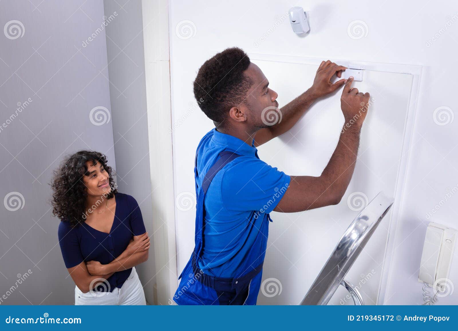 Installing Security System Door Sensor on Wall Stock Photo - Image of ...