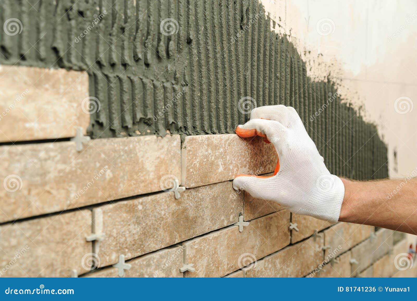 Installing the Tiles on the Wall. Stock Photo - Image of repairman ...