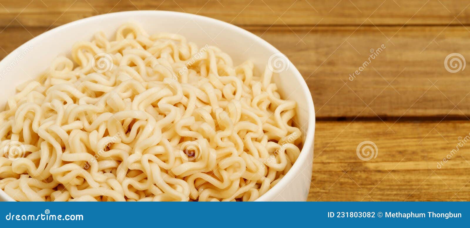 The Instant Noodles Were Placed in a White Cup on the Dining Table ...