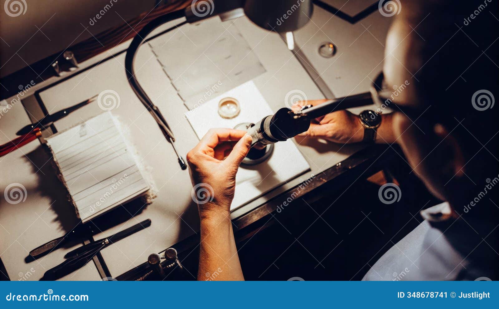 An Instructional Scene Where a Technician is Using a Microscope To ...