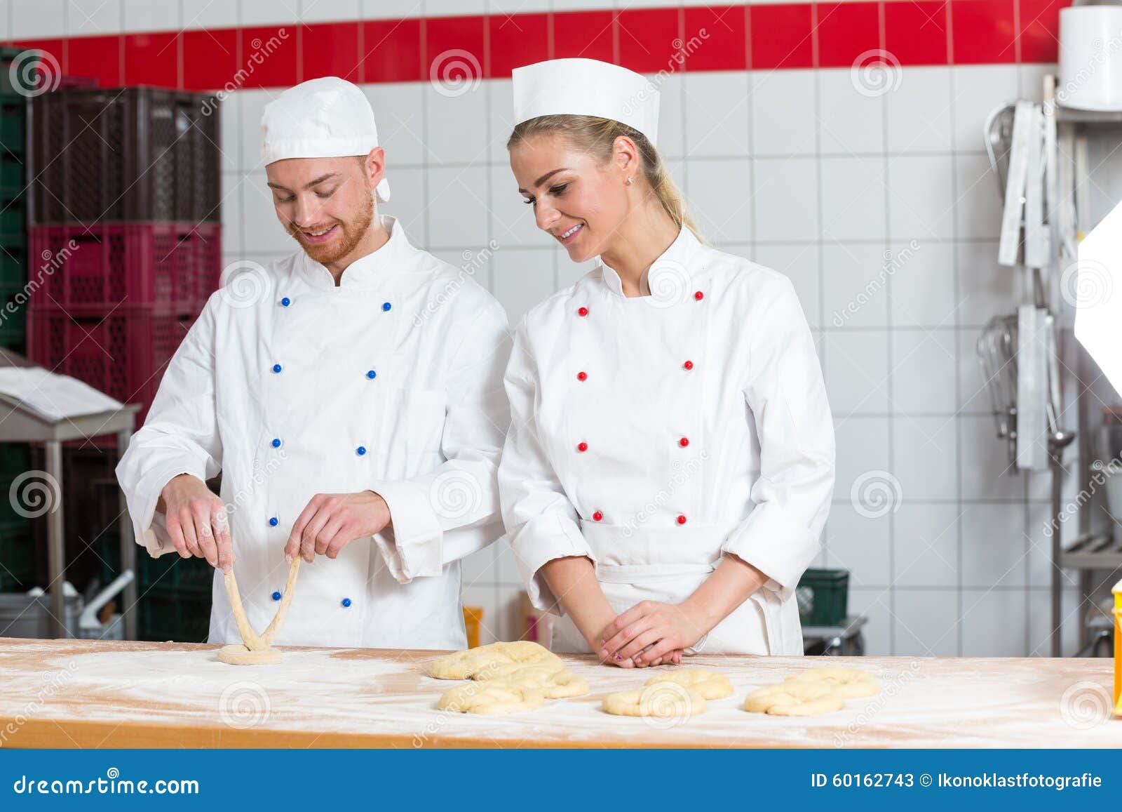 Instructor and Apprentice in Bakery Making Pretzels Stock Image - Image ...