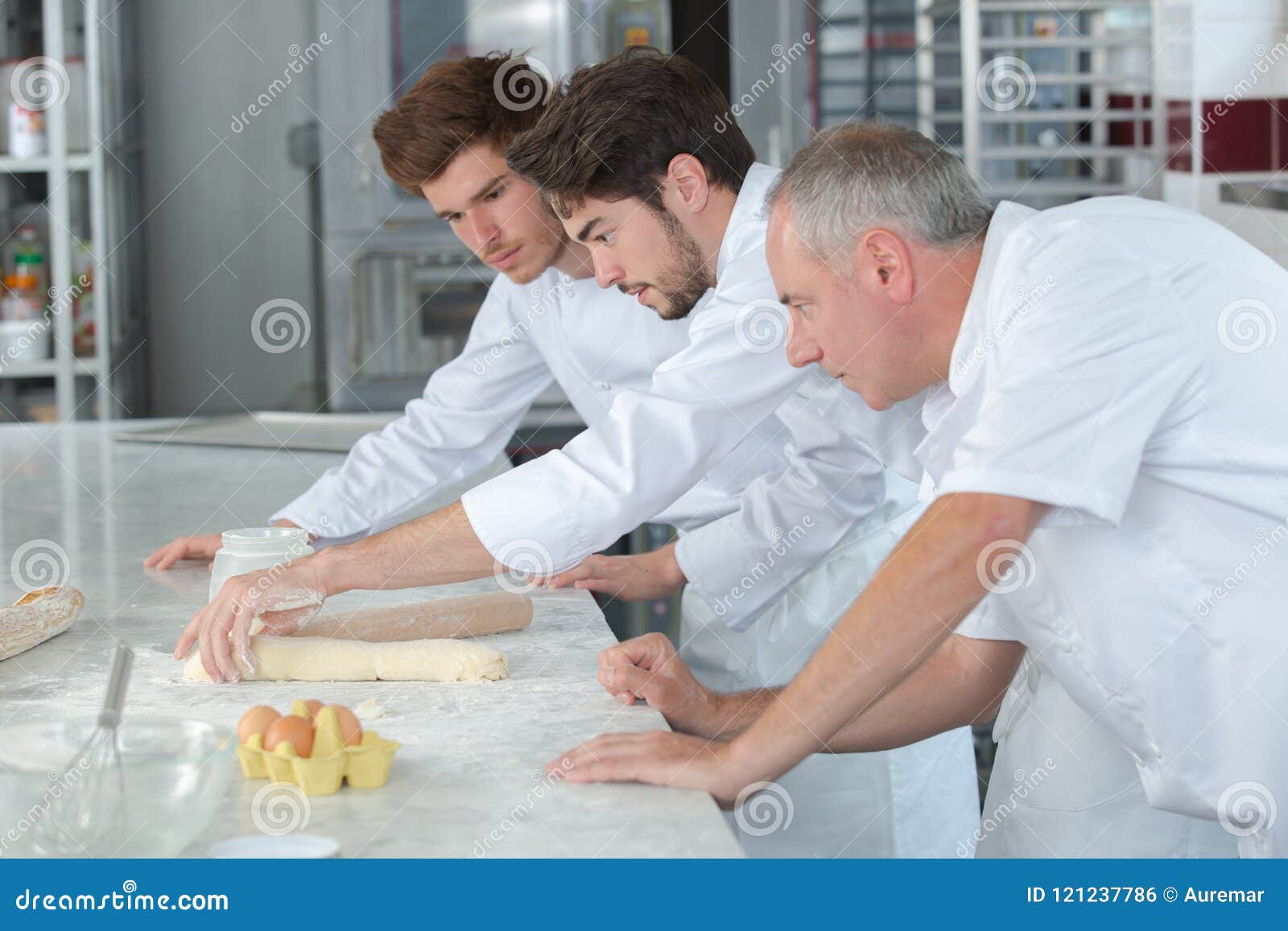 Instructor in Bakery Teaching Apprentices Stock Photo - Image of ...