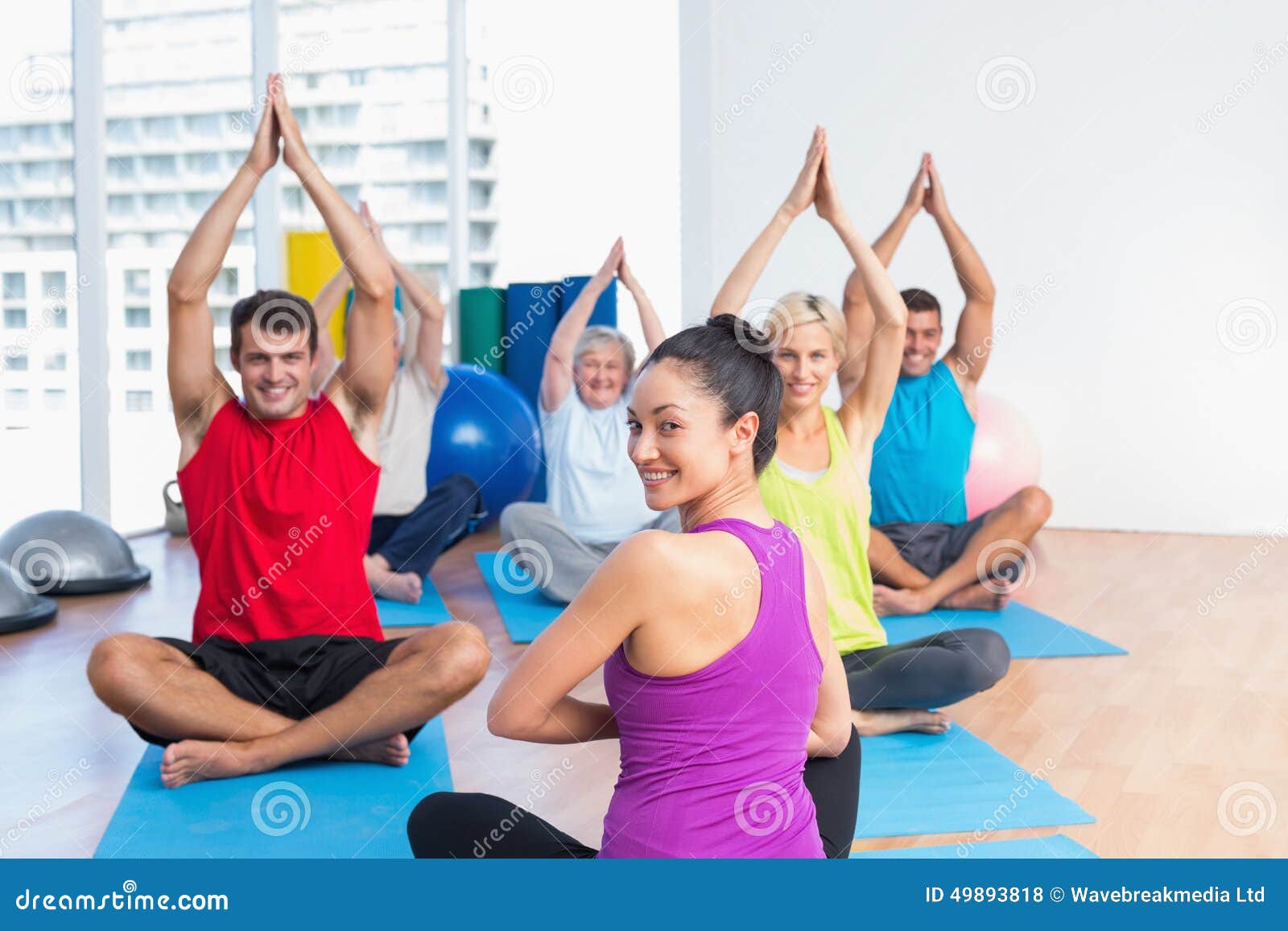 Instructor with Class Practicing Yoga in Fitness Studio Stock Photo ...